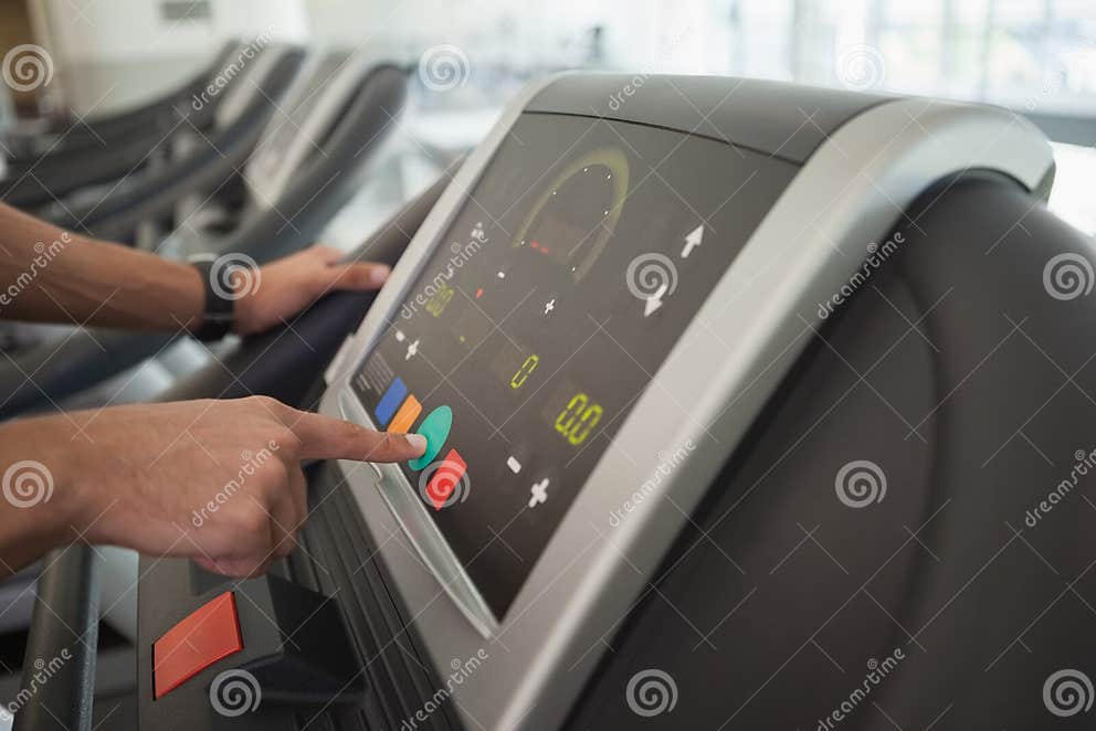 Man Adjusting Settings on the Treadmill Stock Image - Image of ...