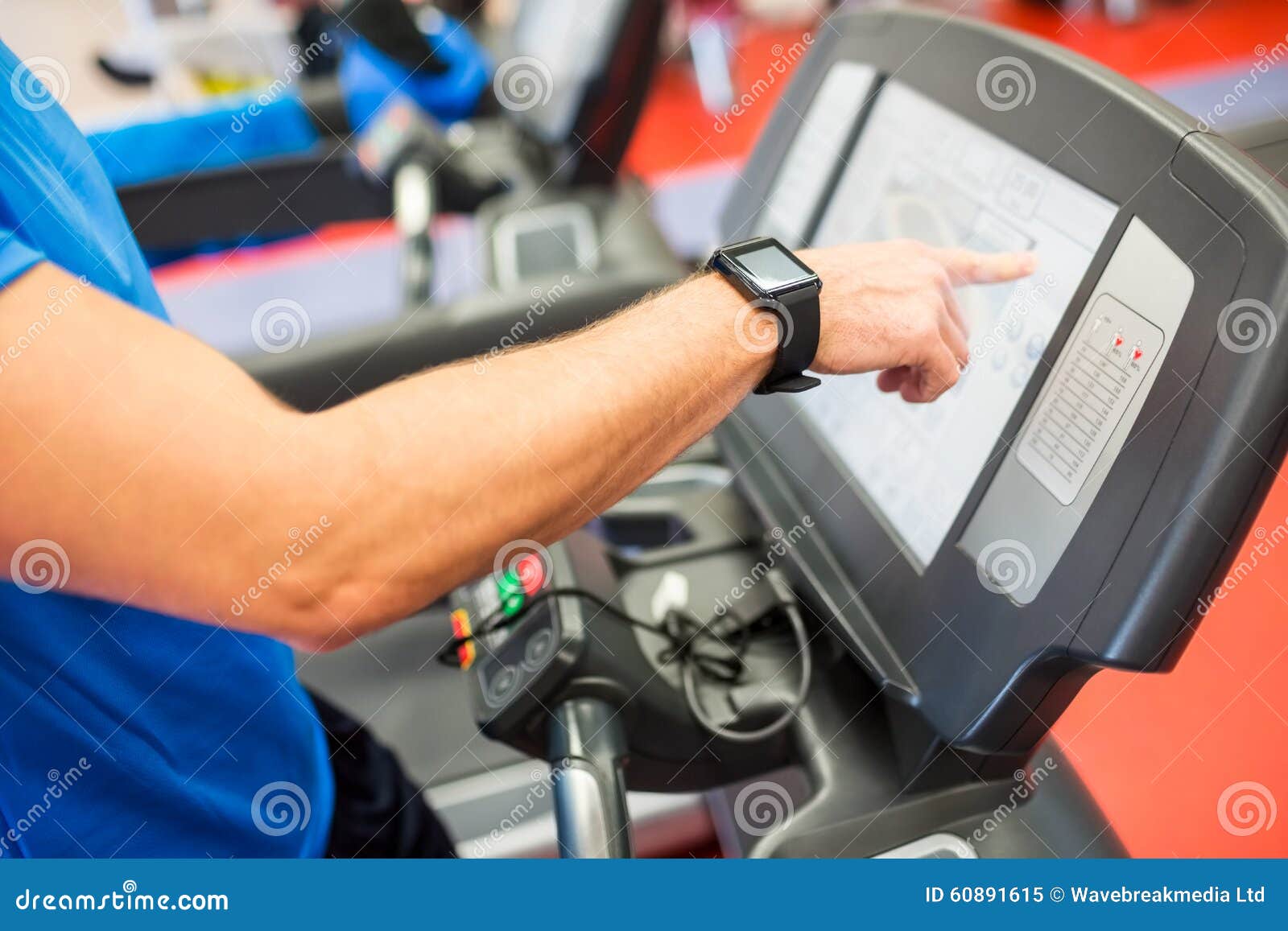 Man Adjusting the Settings of a Treadmill Stock Image - Image of ...