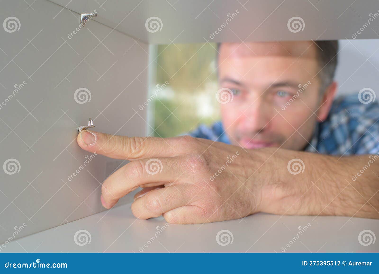 Man Adjusting Shelf Support Stock Photo - Image of frame, shelf: 275395512