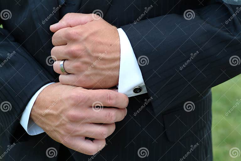 Man adjusting sleeve cuff stock photo. Image of husband - 2215544