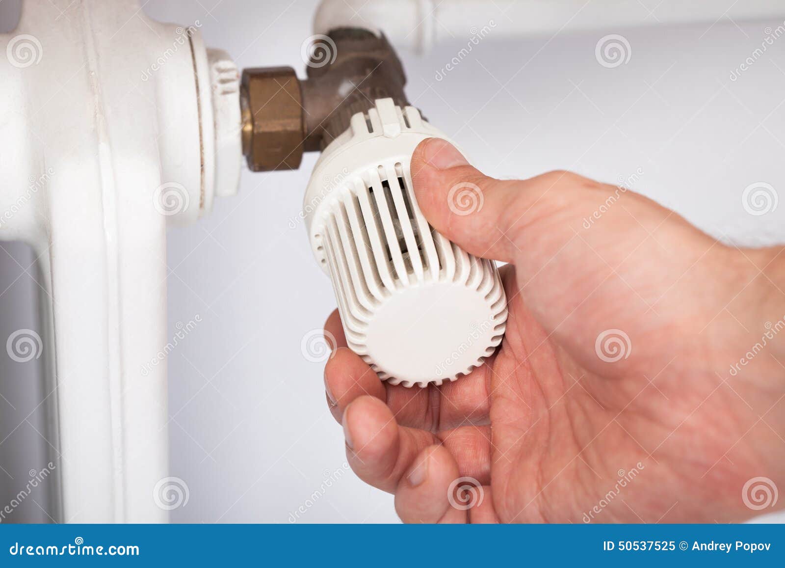 Man Adjusting Temperature on Radiator Thermostat Stock Image - Image of ...