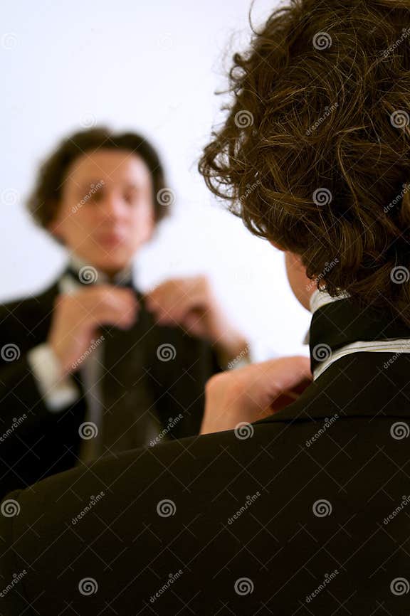 Man Adjusting Tie in the Mirror Stock Image - Image of back, wear: 4741893