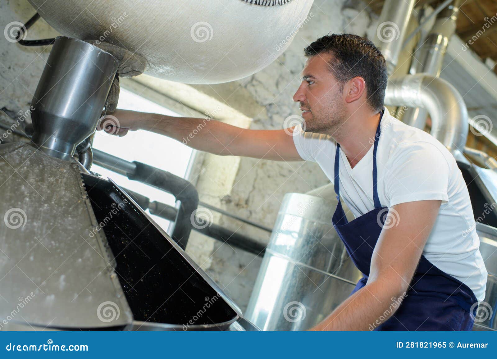 Man adjusting vat stock image. Image of adjusting, apron - 281821965