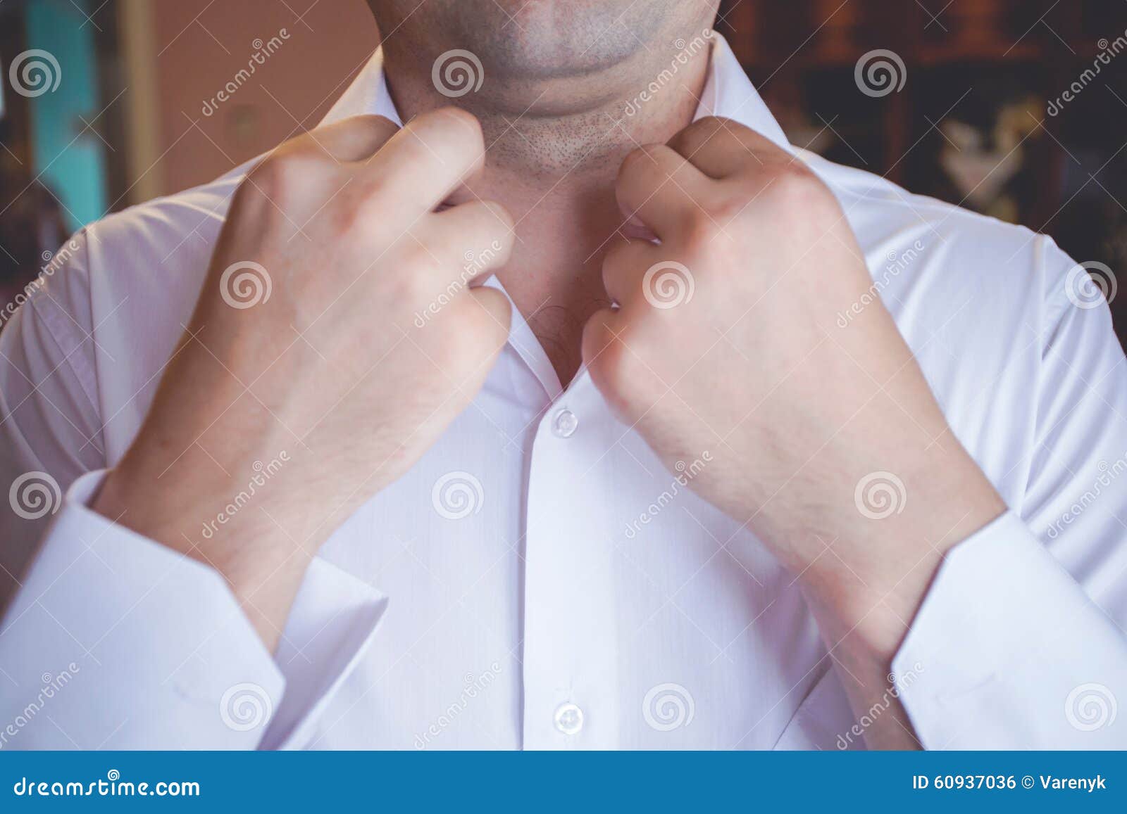 A man adjusts his collar stock photo. Image of bridegroom - 60937036
