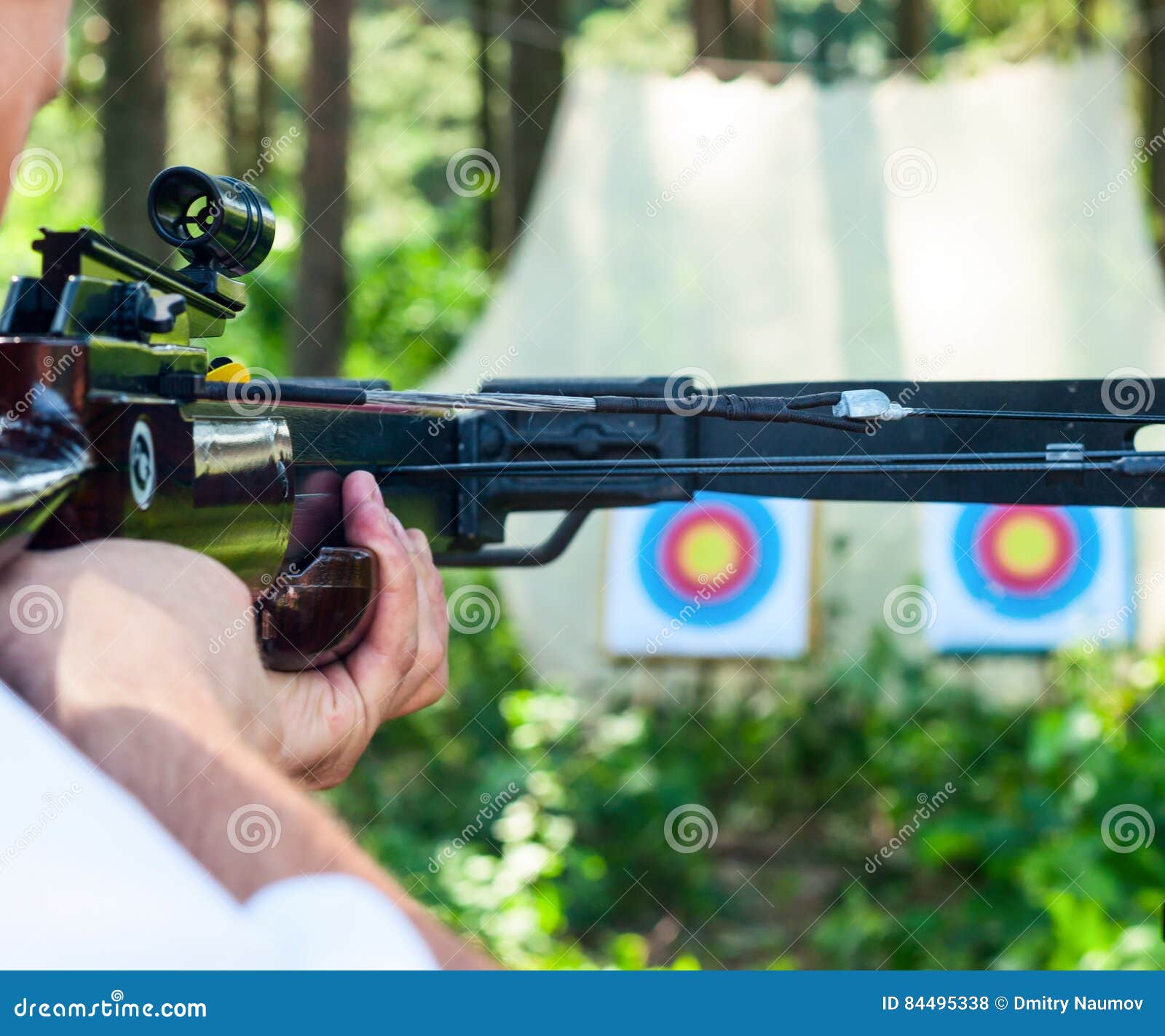 Man Aiming Crossbow at Target Stock Photo - Image of forest, arrow ...