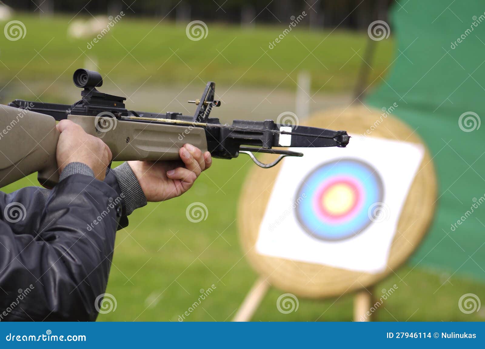 Man Aiming Crossbow at Targets Stock Photo - Image of male, finger ...