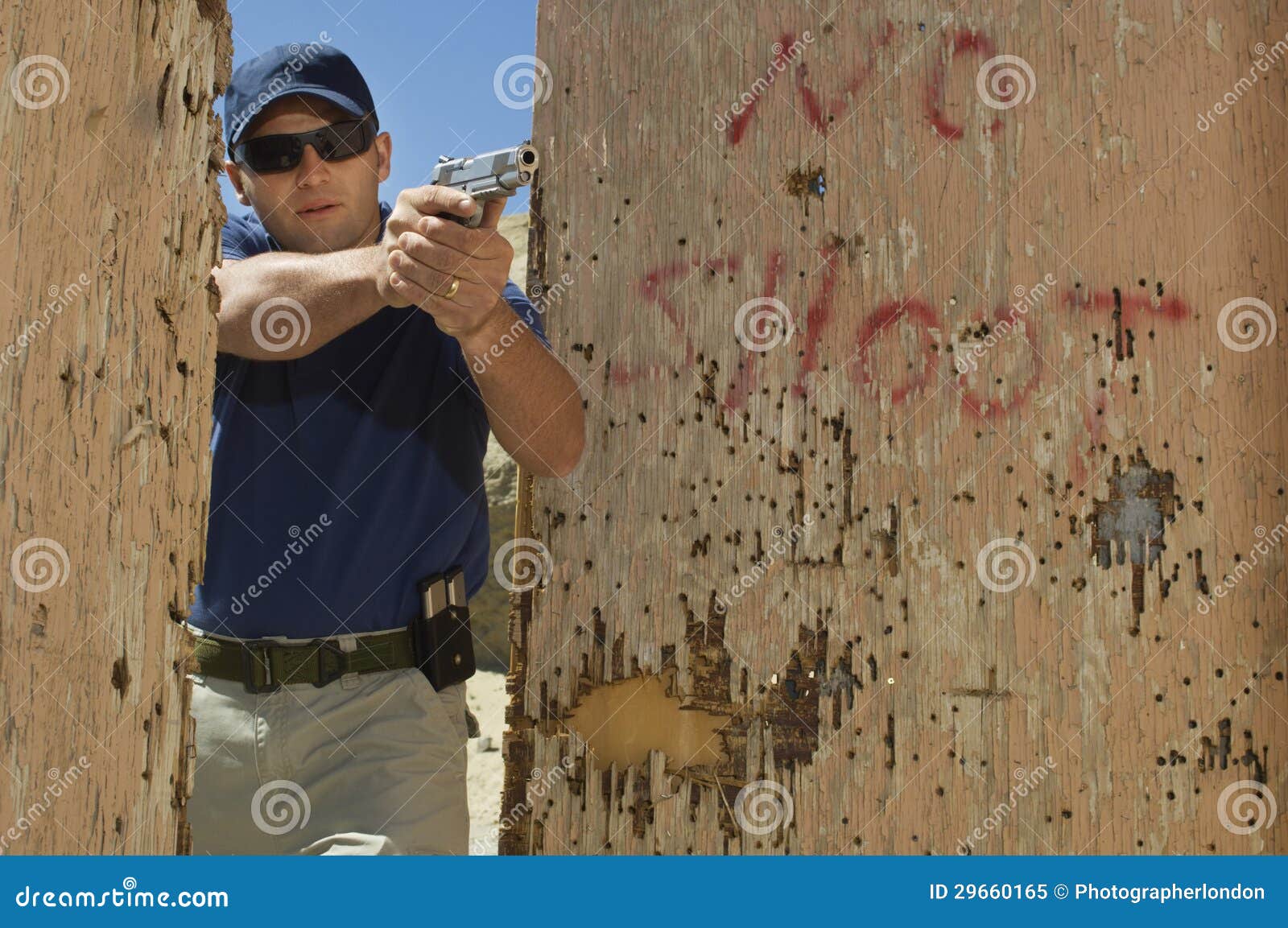Man Aiming Hand Gun at Firing Range Stock Image - Image of officer ...