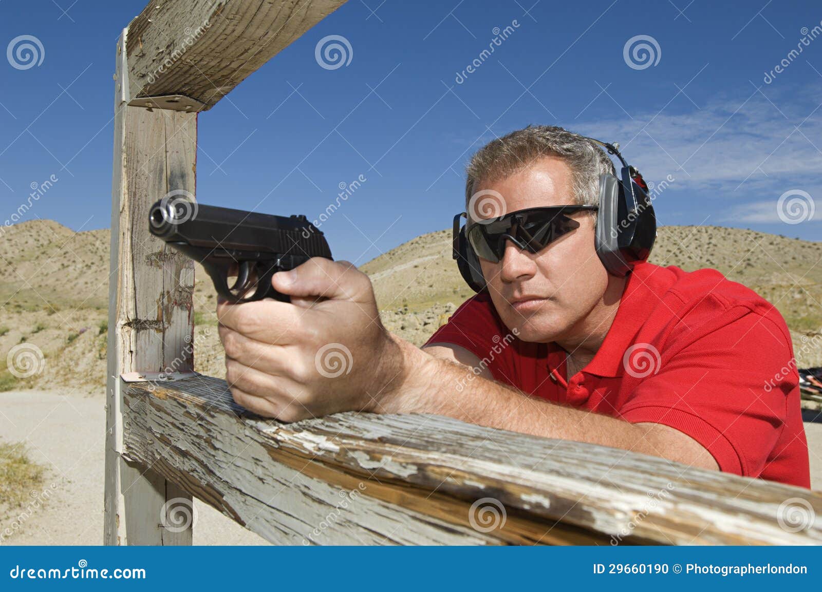 Man Aiming Hand Gun at Firing Range Stock Photo - Image of combat ...