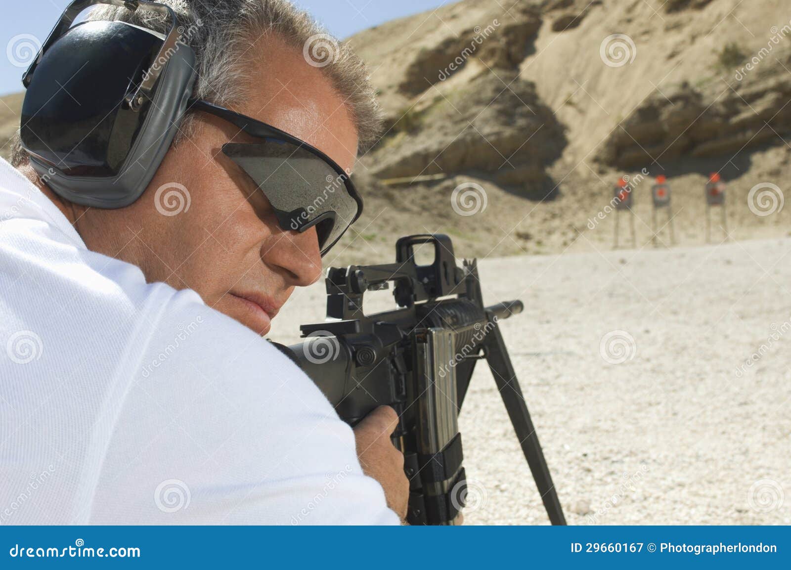 Man Aiming Machine Gun at Firing Range Stock Image - Image of mountain ...