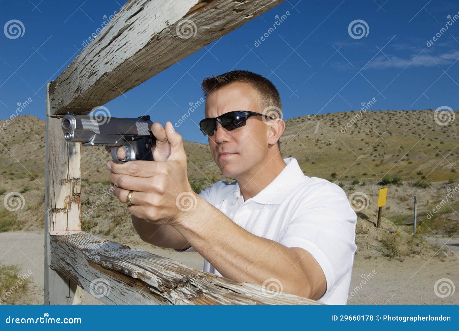 Man Aiming Machine Gun at Firing Range Stock Photo - Image of firearm ...