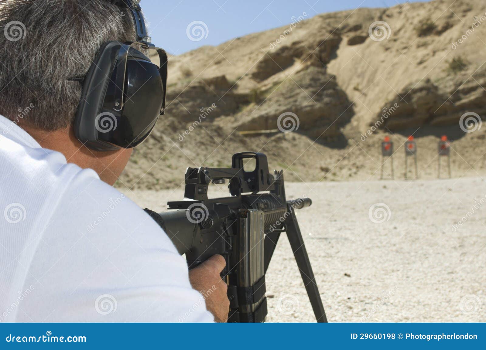 Man Aiming Machine Gun at Firing Range Stock Photo - Image of lying ...