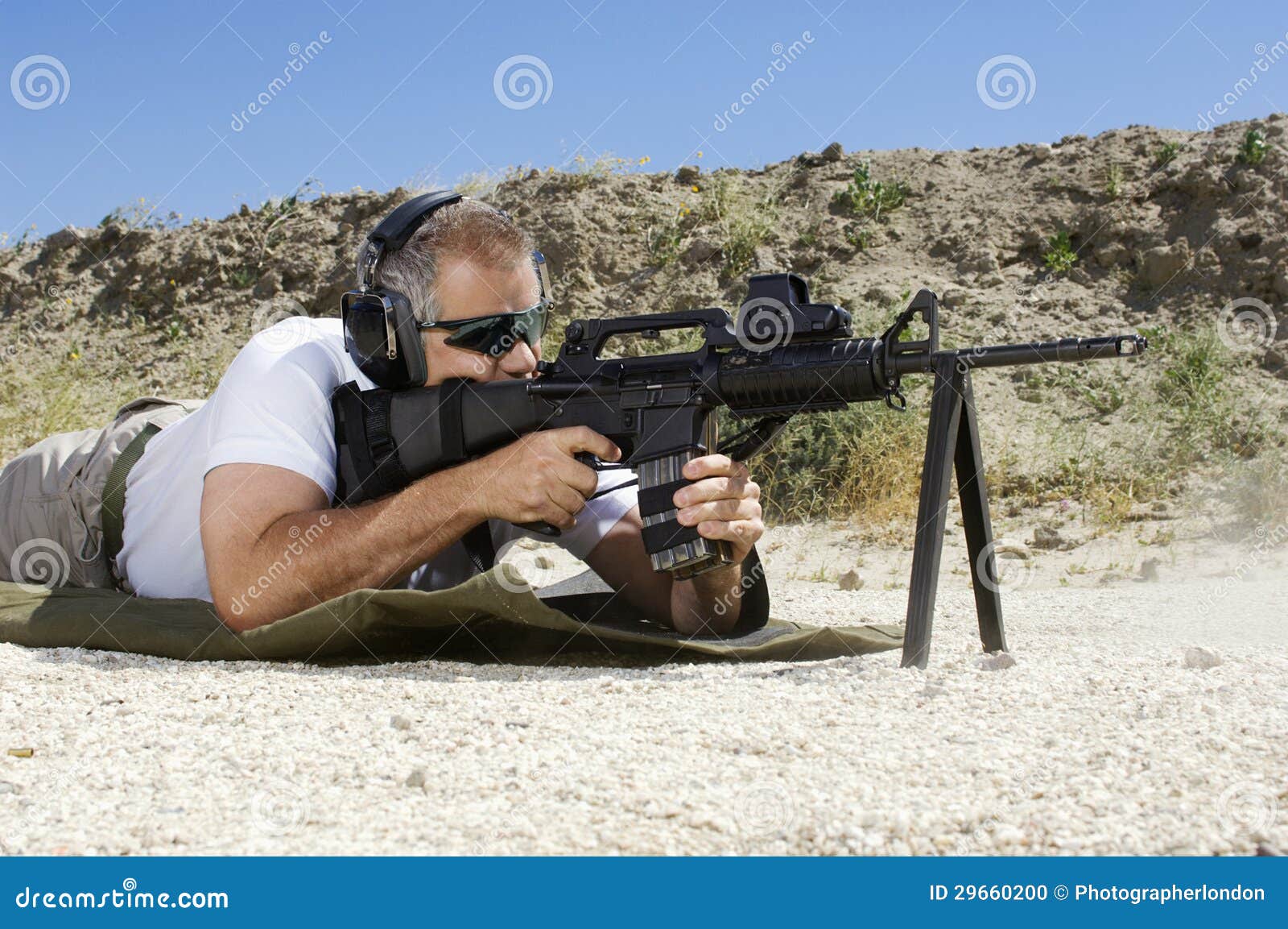 Man Aiming Machine Gun at Firing Range Stock Photo - Image of holding ...
