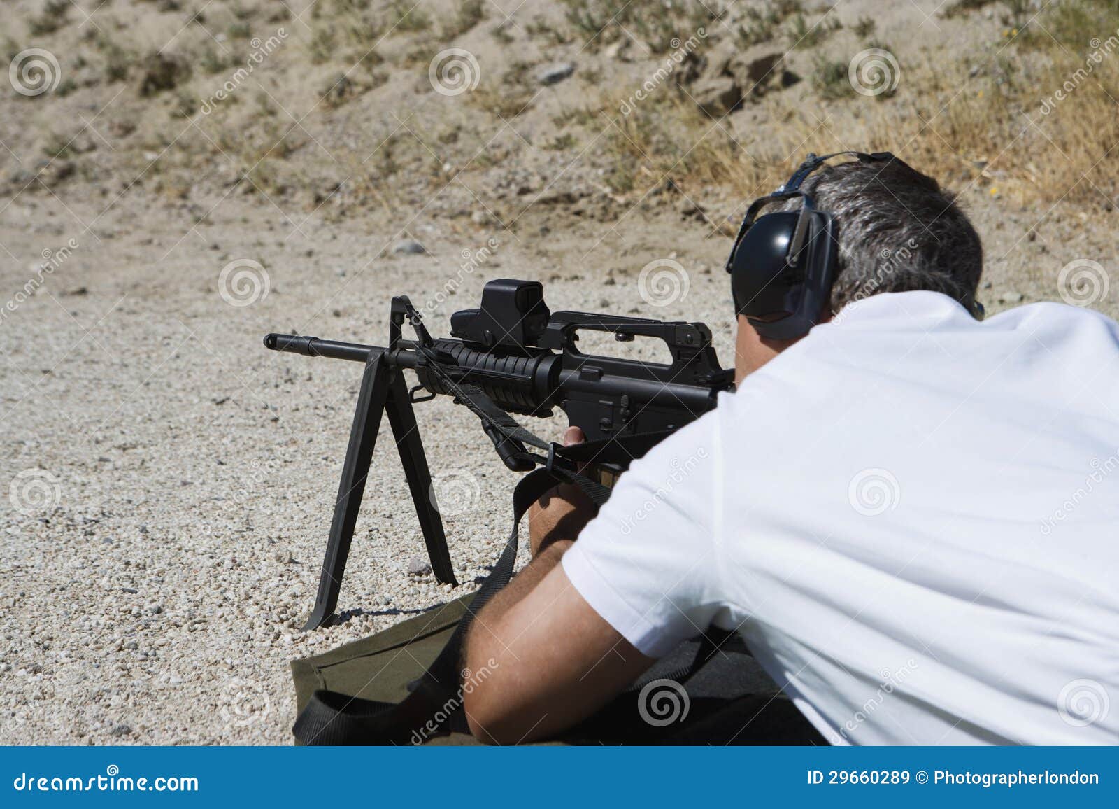 Man Aiming Machine Gun at Firing Range Stock Image - Image of officer ...