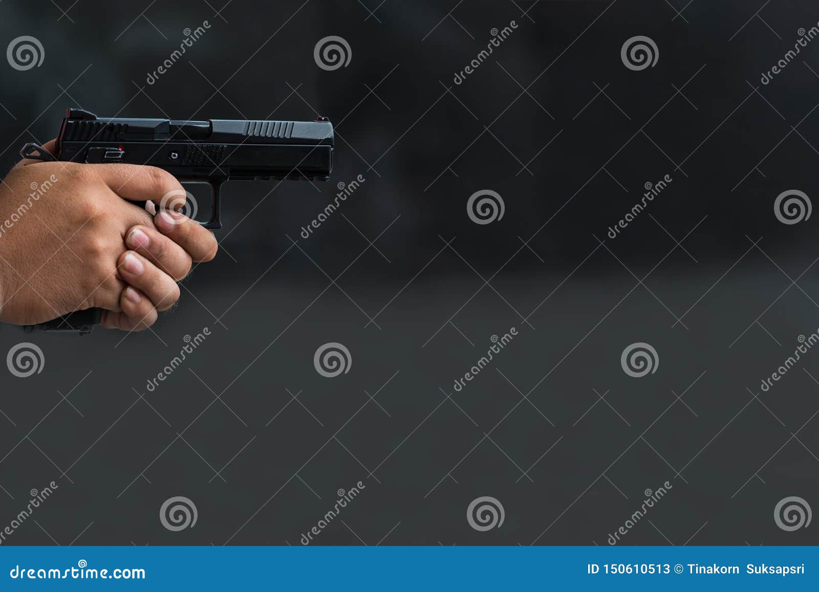 Man Holding Gun Ready To Shoot for Protect and Security Stock Image ...