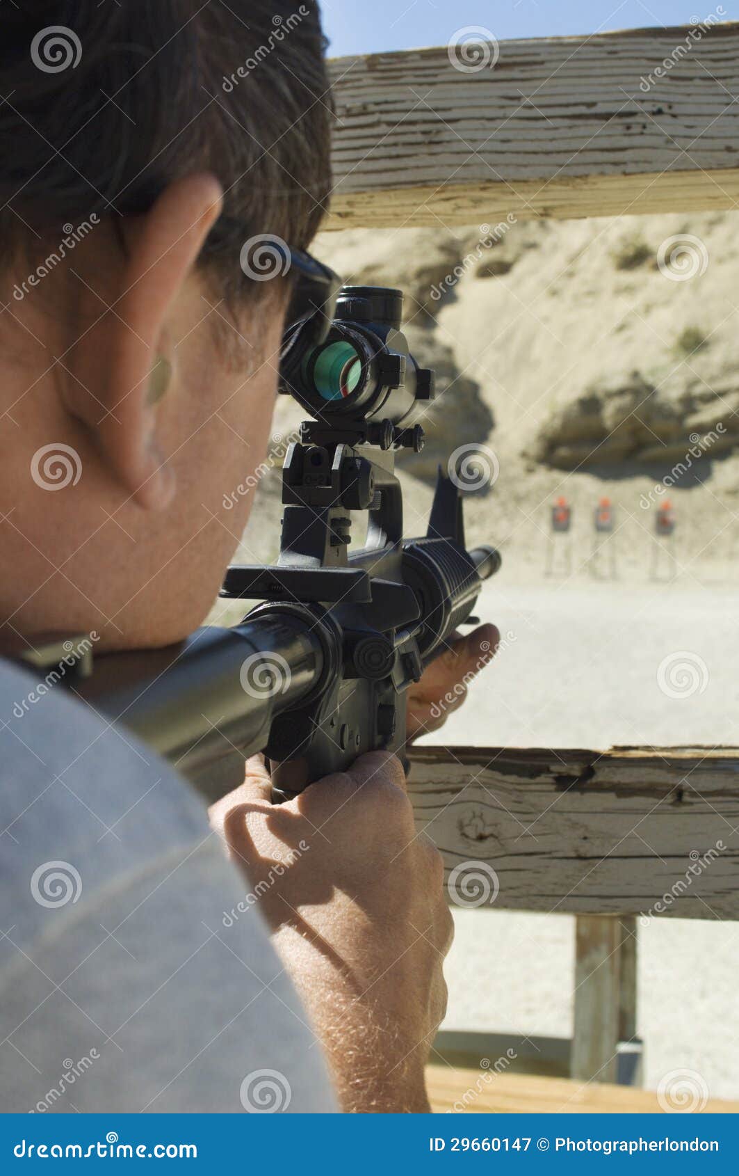 Man Aiming Rifle at Firing Range Stock Image - Image of closeup, rifle ...