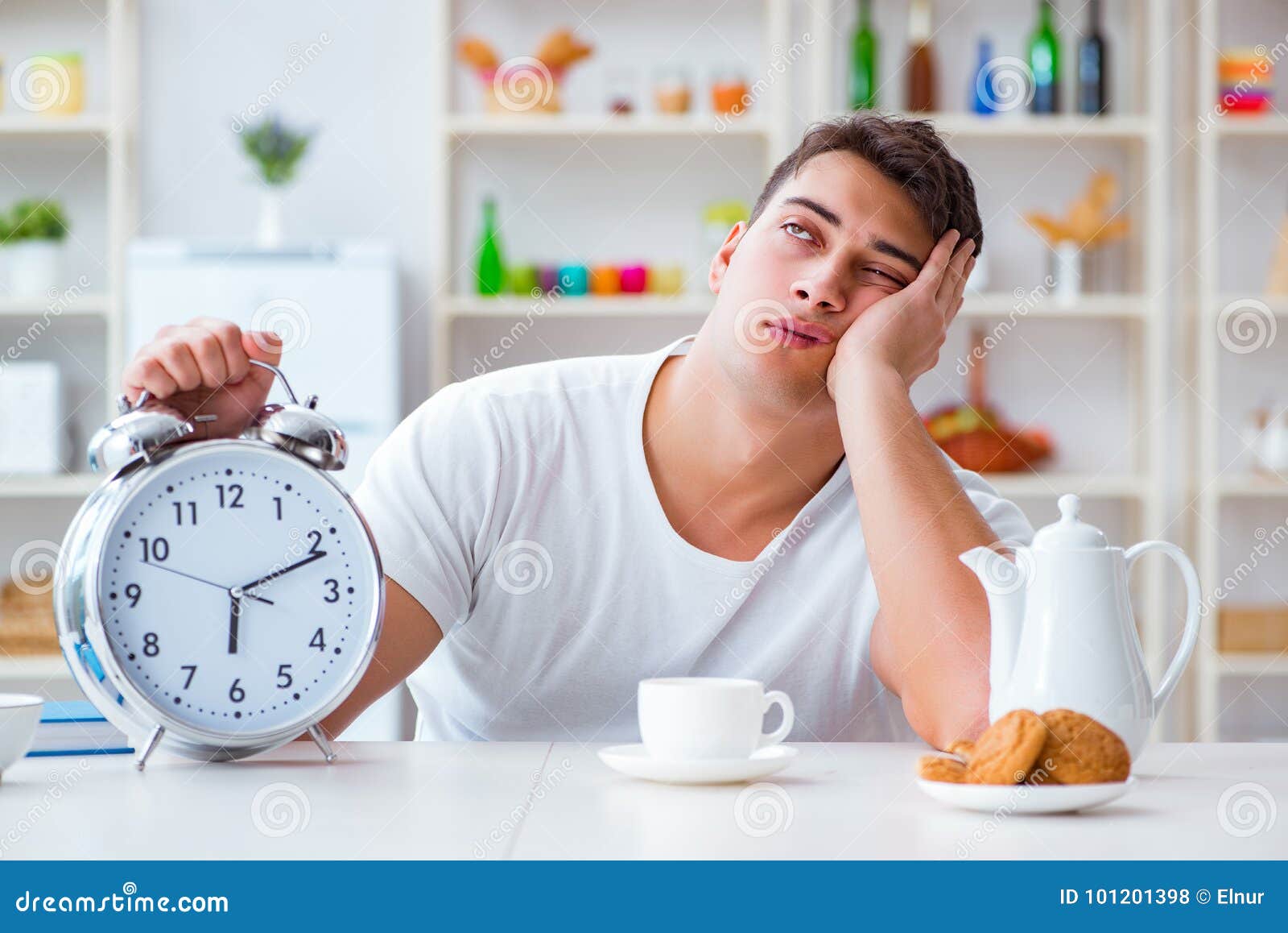 The Man with Alarm Clock Falling Asleep at Breakfast Stock Photo ...