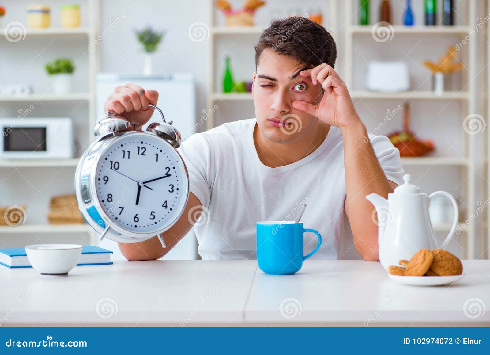 The Man with Alarm Clock Falling Asleep at Breakfast Stock Photo ...