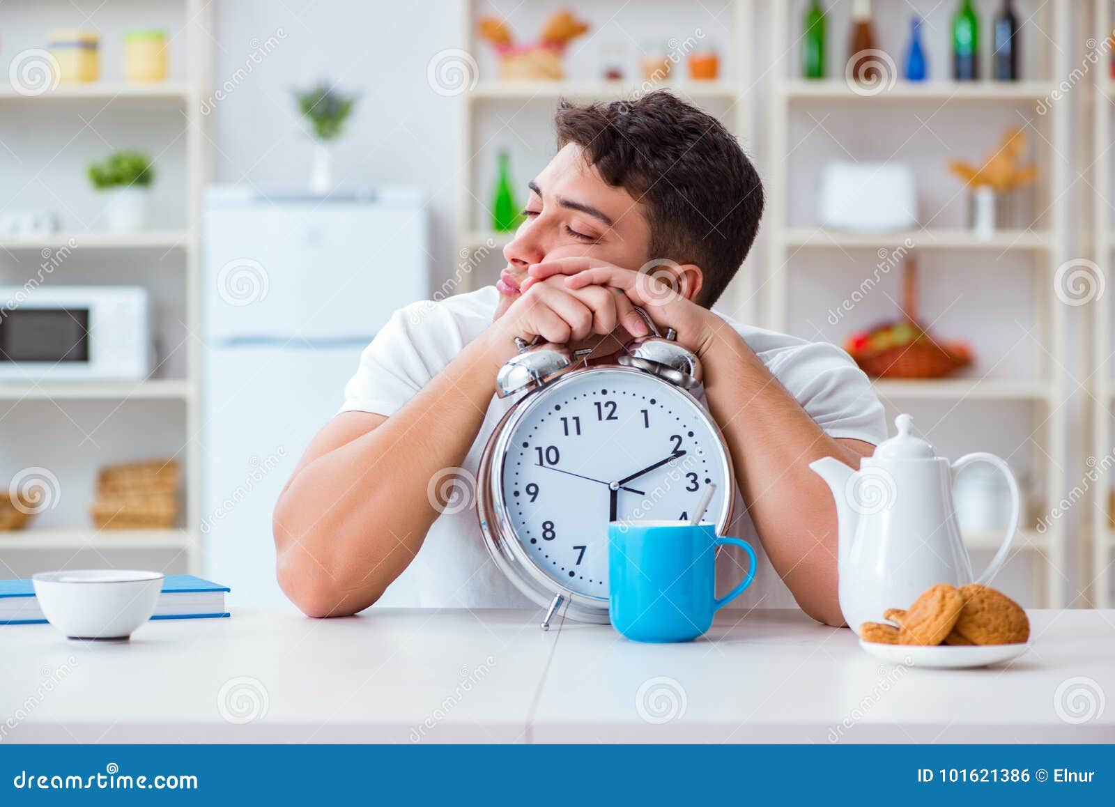 The Man with Alarm Clock Falling Asleep at Breakfast Stock Photo ...