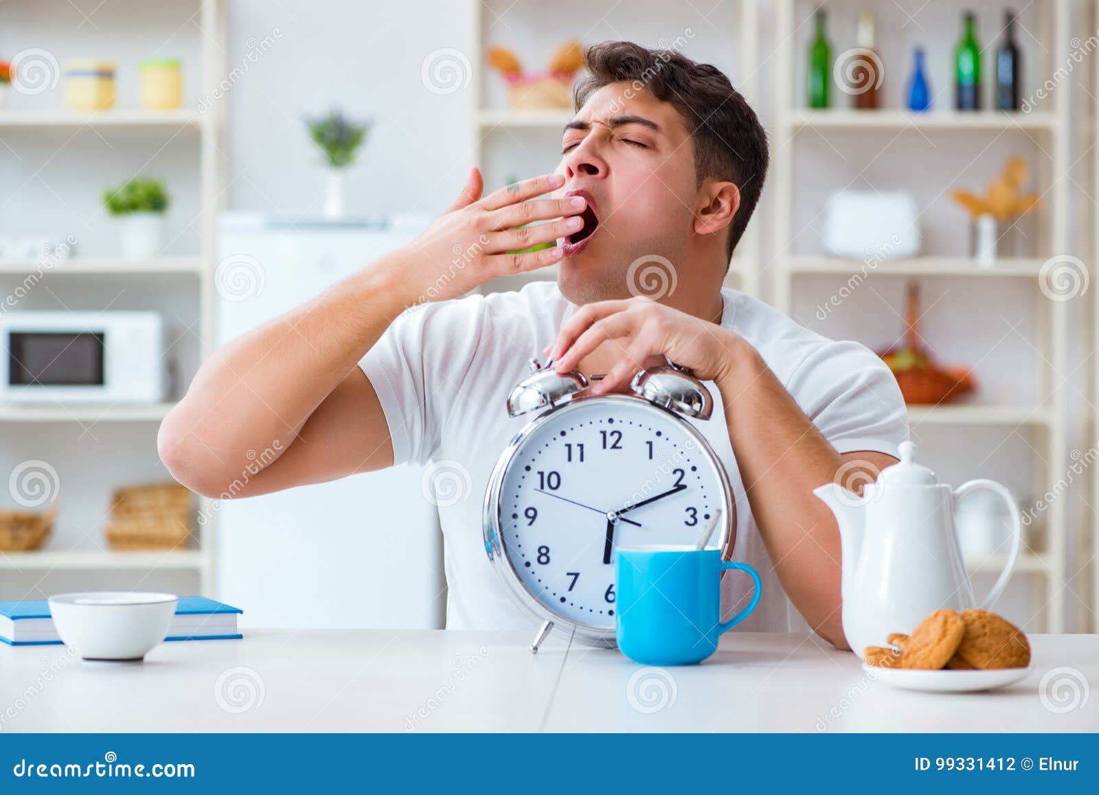 The Man with Alarm Clock Falling Asleep at Breakfast Stock Photo ...