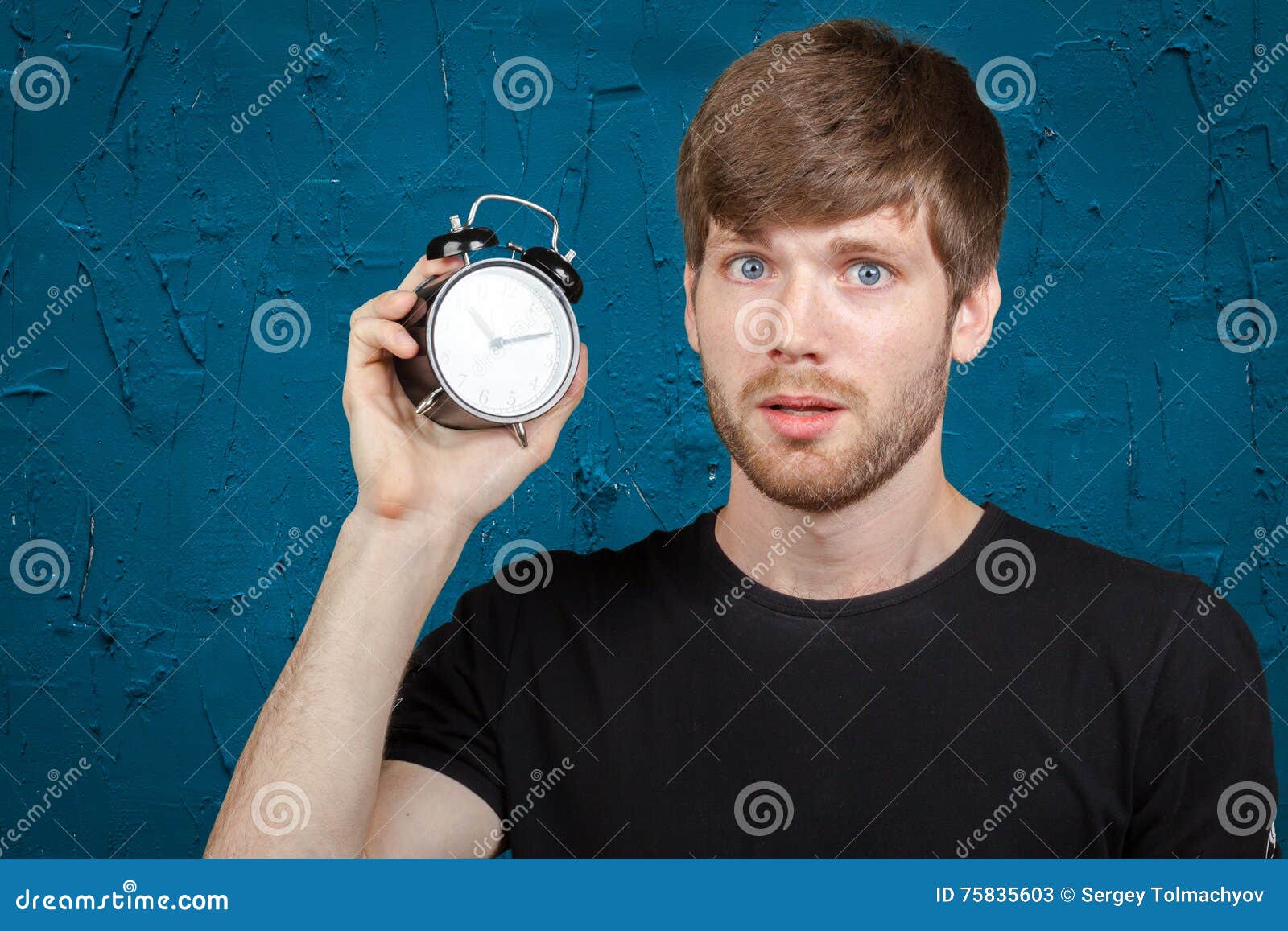 Man with alarm clock stock image. Image of hold, home - 75835603