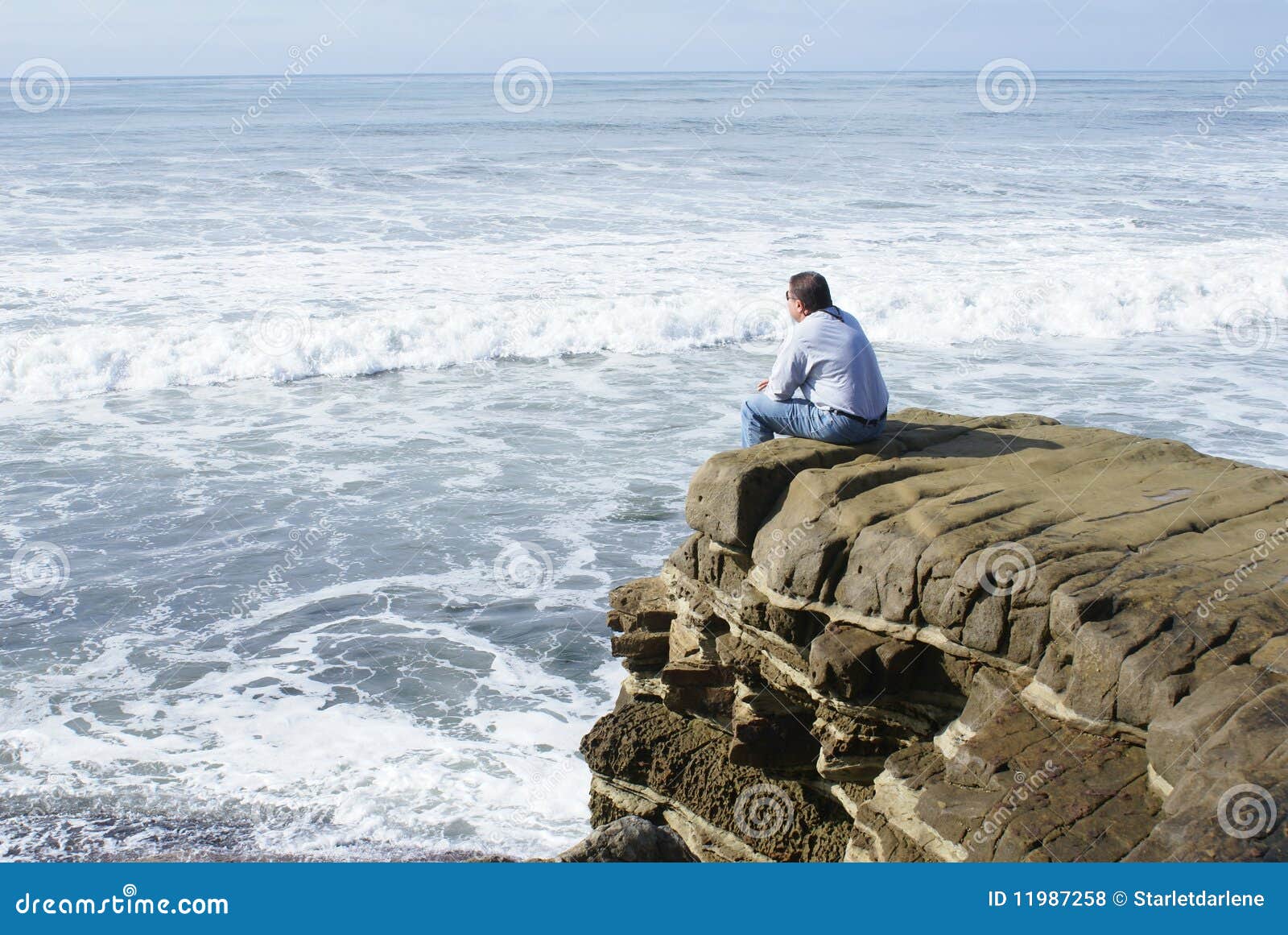 Man Alone Meditating or Thinking Stock Photo - Image of cliff, sitting ...
