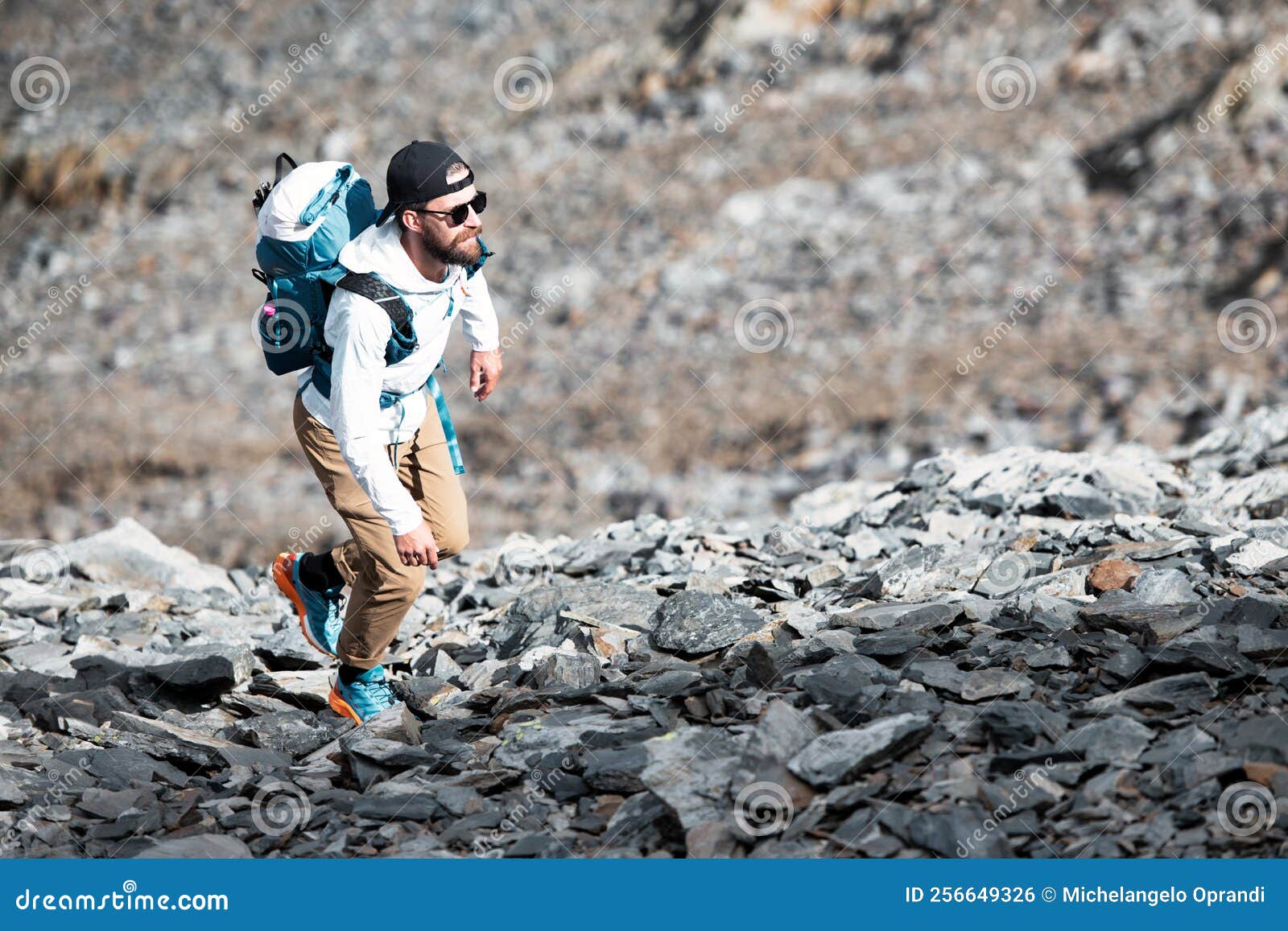 Man during an alpine trek stock photo. Image of active - 256649326