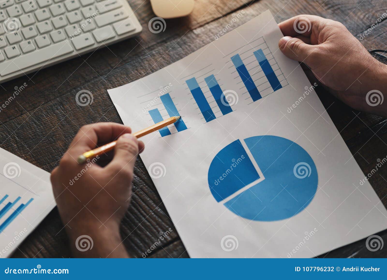 Man Analyzes the Data and Graphs in Office, Top View Stock Photo ...
