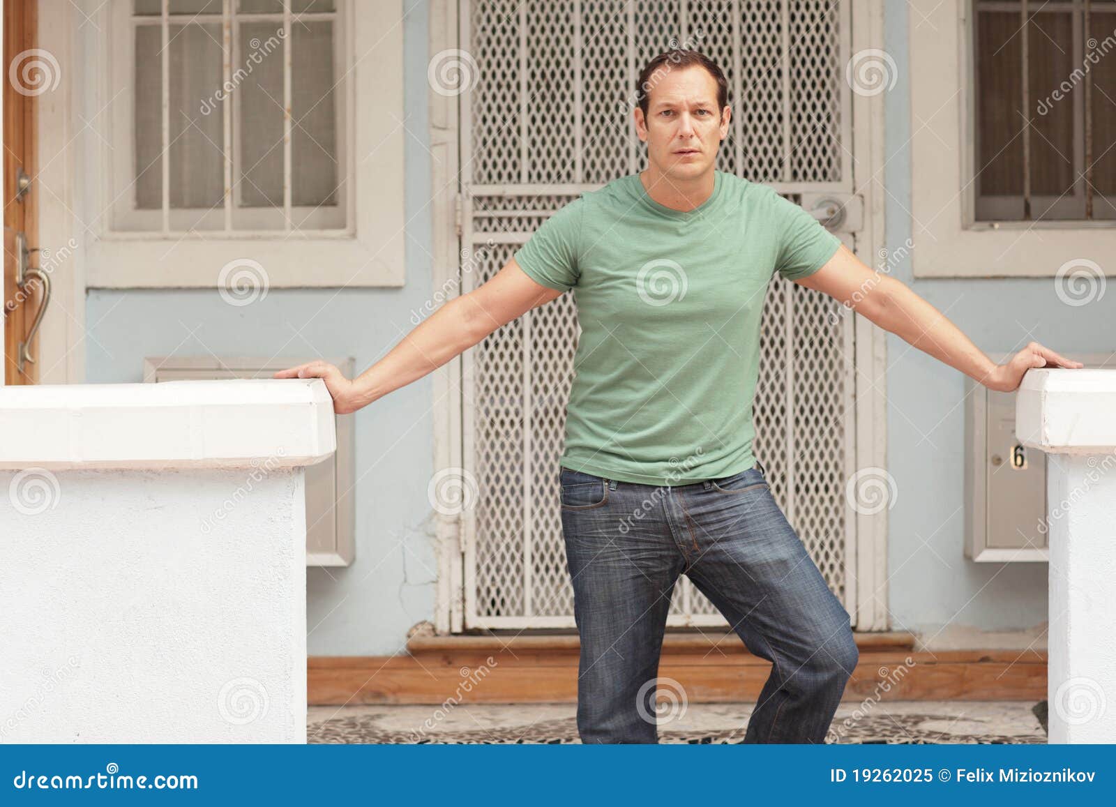Man by an Apartment Building Stock Image - Image of ledge, caucasian ...