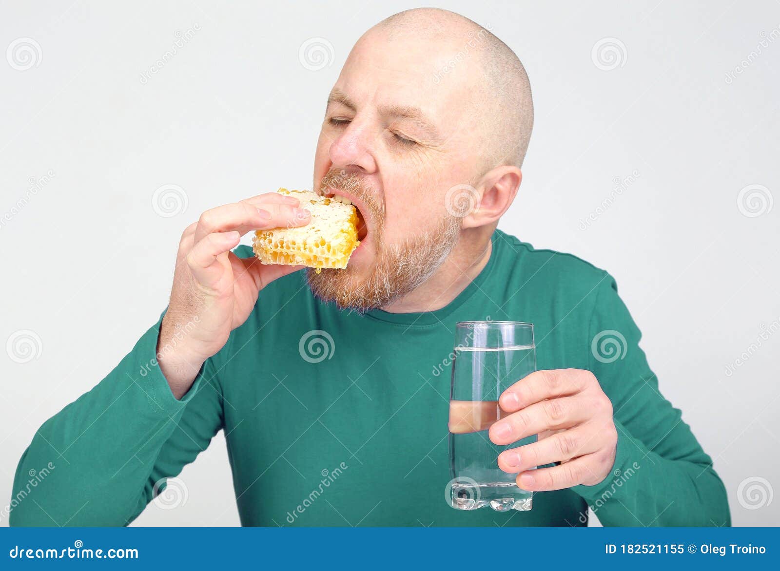 The Man is Appetizing Eats Honey. Healthy and Proper Nutrition Stock ...