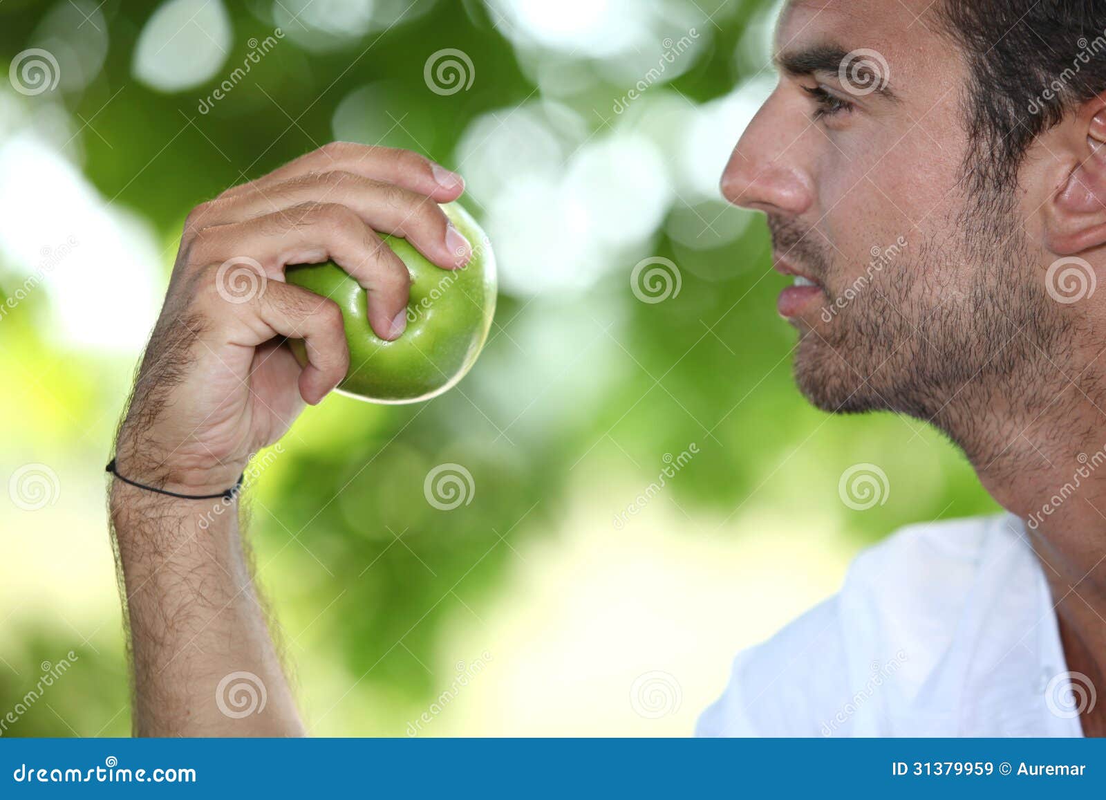 Man with an apple stock image. Image of background, holding - 31379959