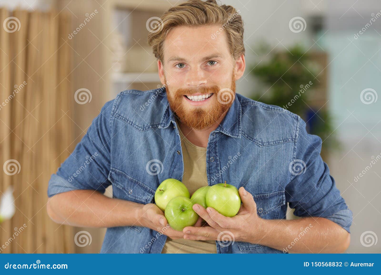 Man with apple fruit stock photo. Image of casual, apples - 150568832