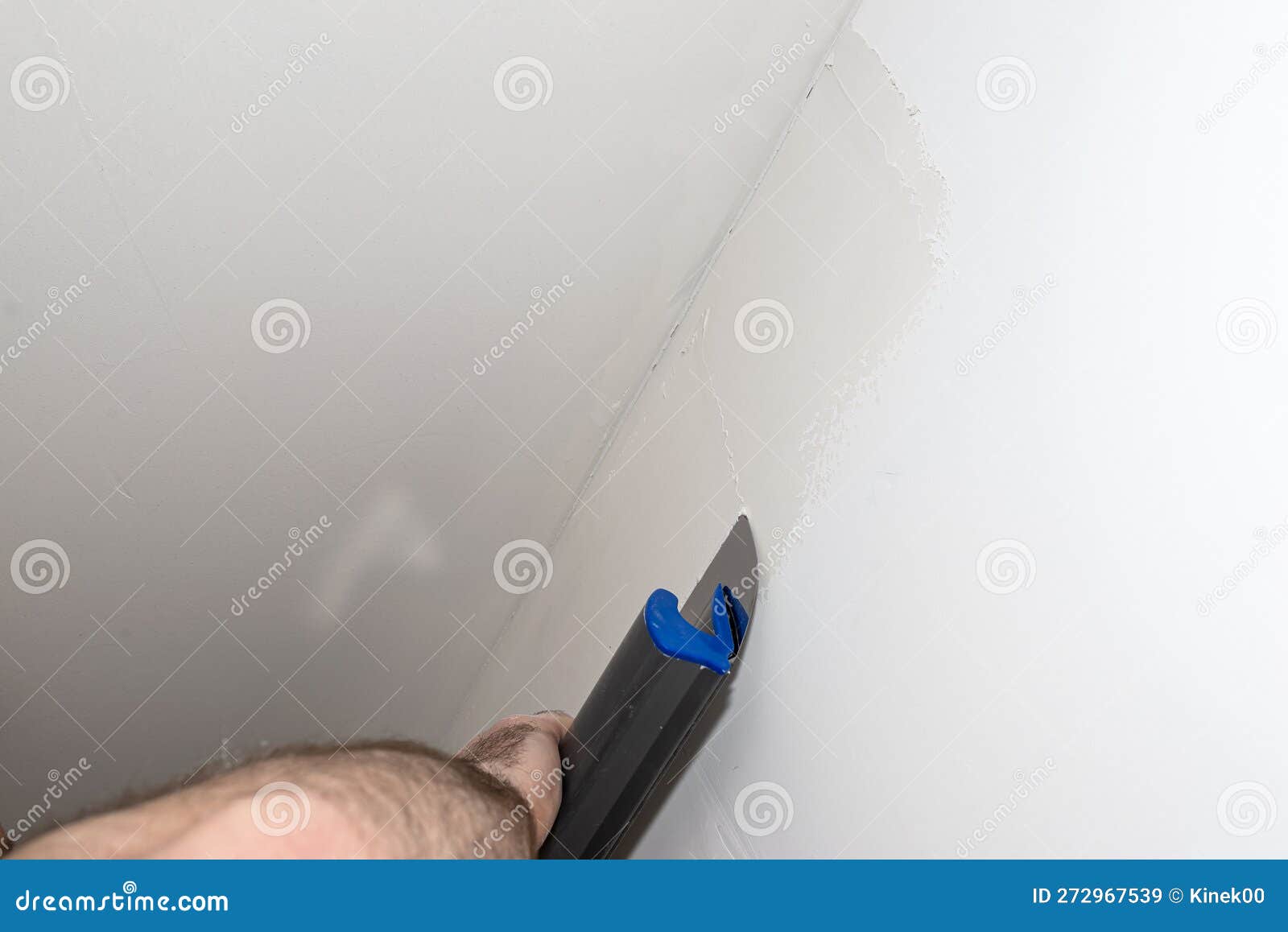 A Man Applies Ready-made Polymer Plaster from a Bucket Using Special ...