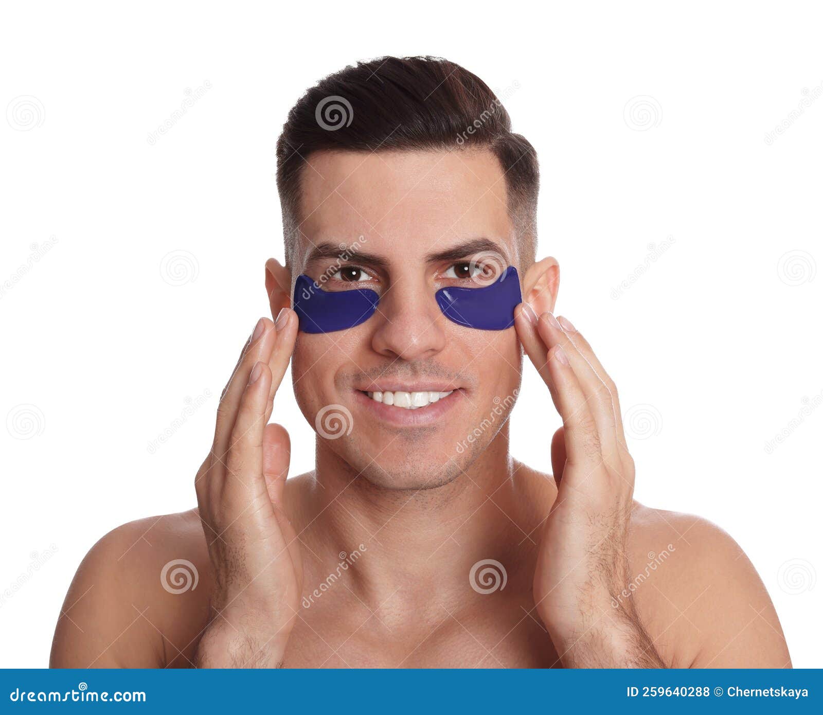 Man Applying Blue Under Eye Patch on White Background Stock Photo ...