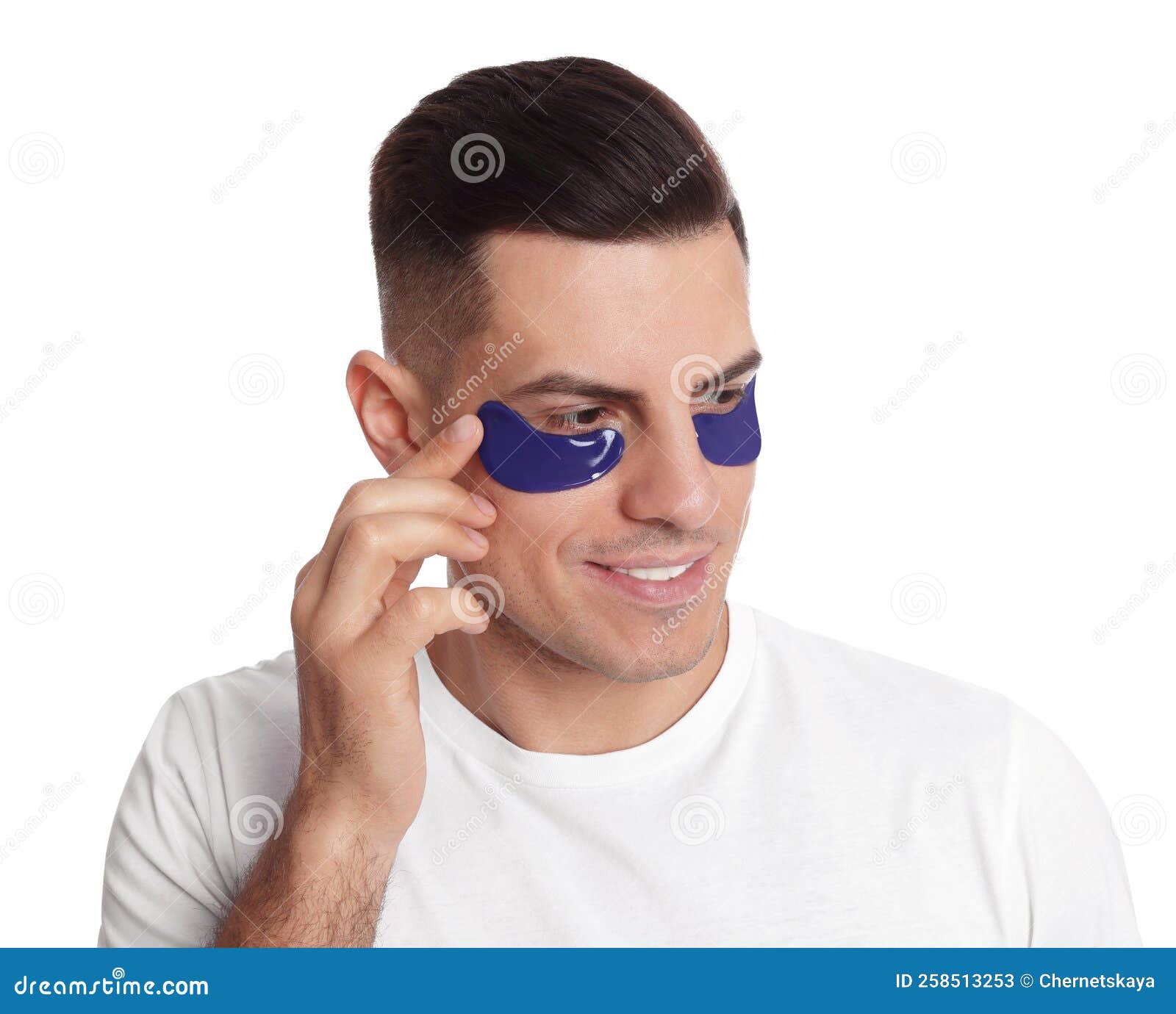 Man Applying Blue Under Eye Patch on White Background Stock Image ...