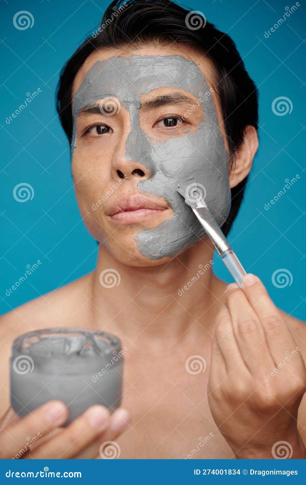 Man Applying Clay Mask stock photo. Image of cosmetic - 274001834