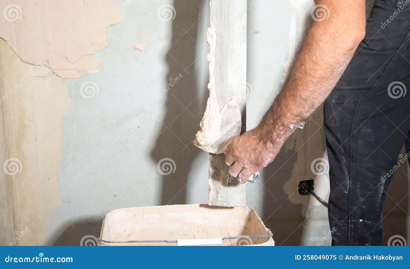Man is Applying Putty on a Wall. Renovating House Stock Image - Image ...