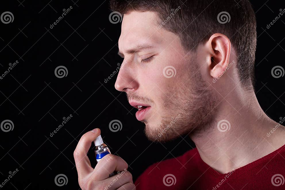 Man Applying Spray for Sore Throat Stock Image - Image of male, throat ...