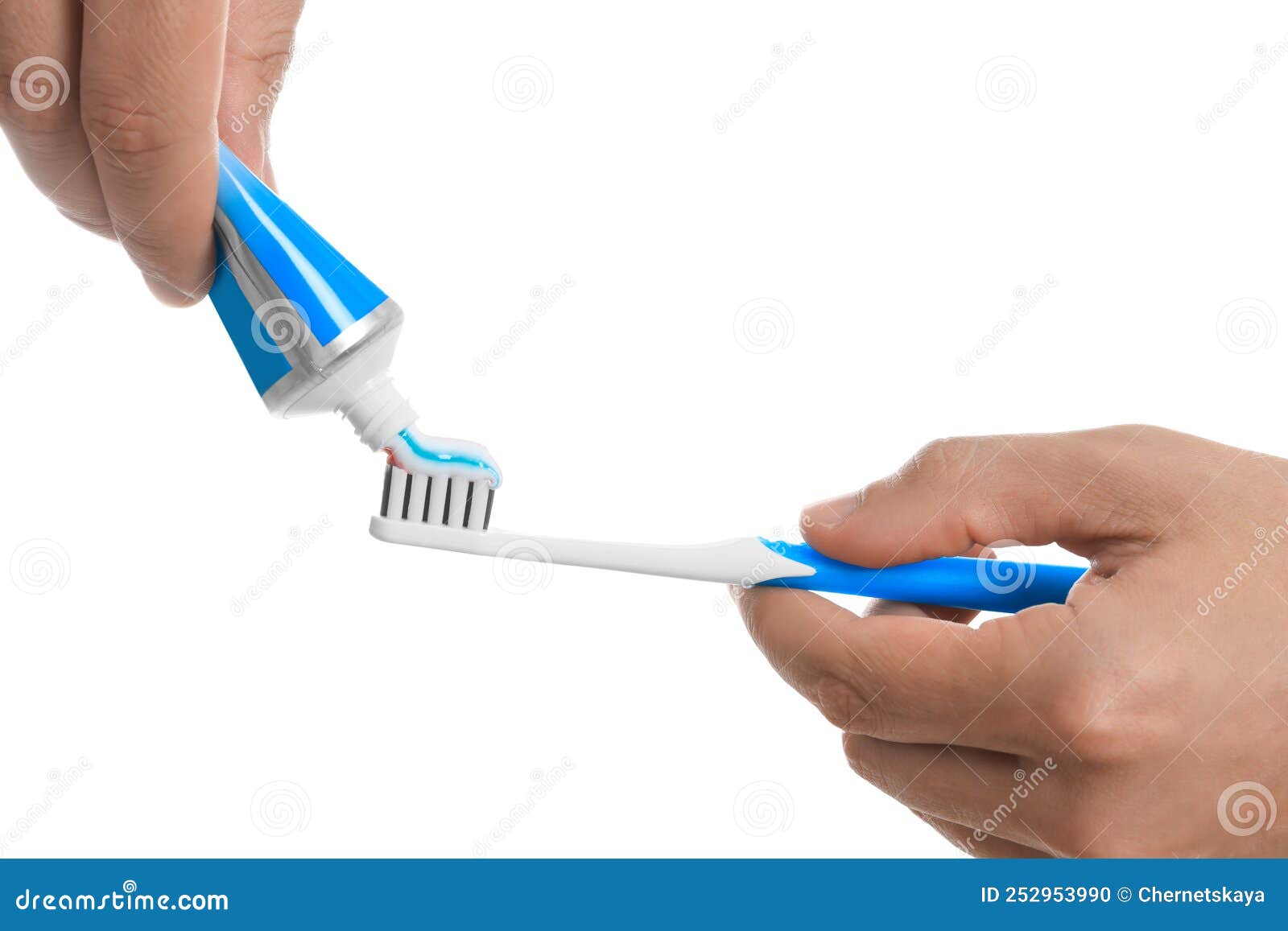 Man Applying Toothpaste on Brush Against White Background, Closeup ...