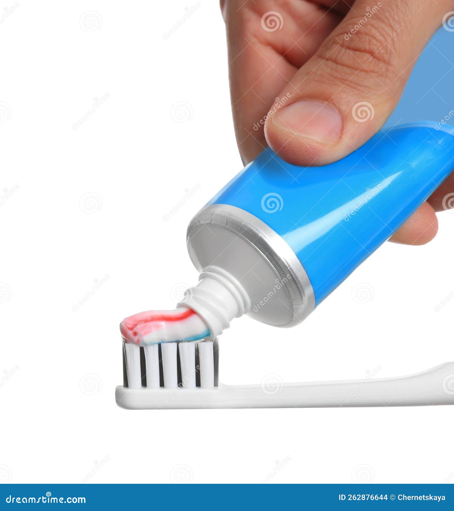 Man Applying Toothpaste on Brush Against White Background, Closeup ...