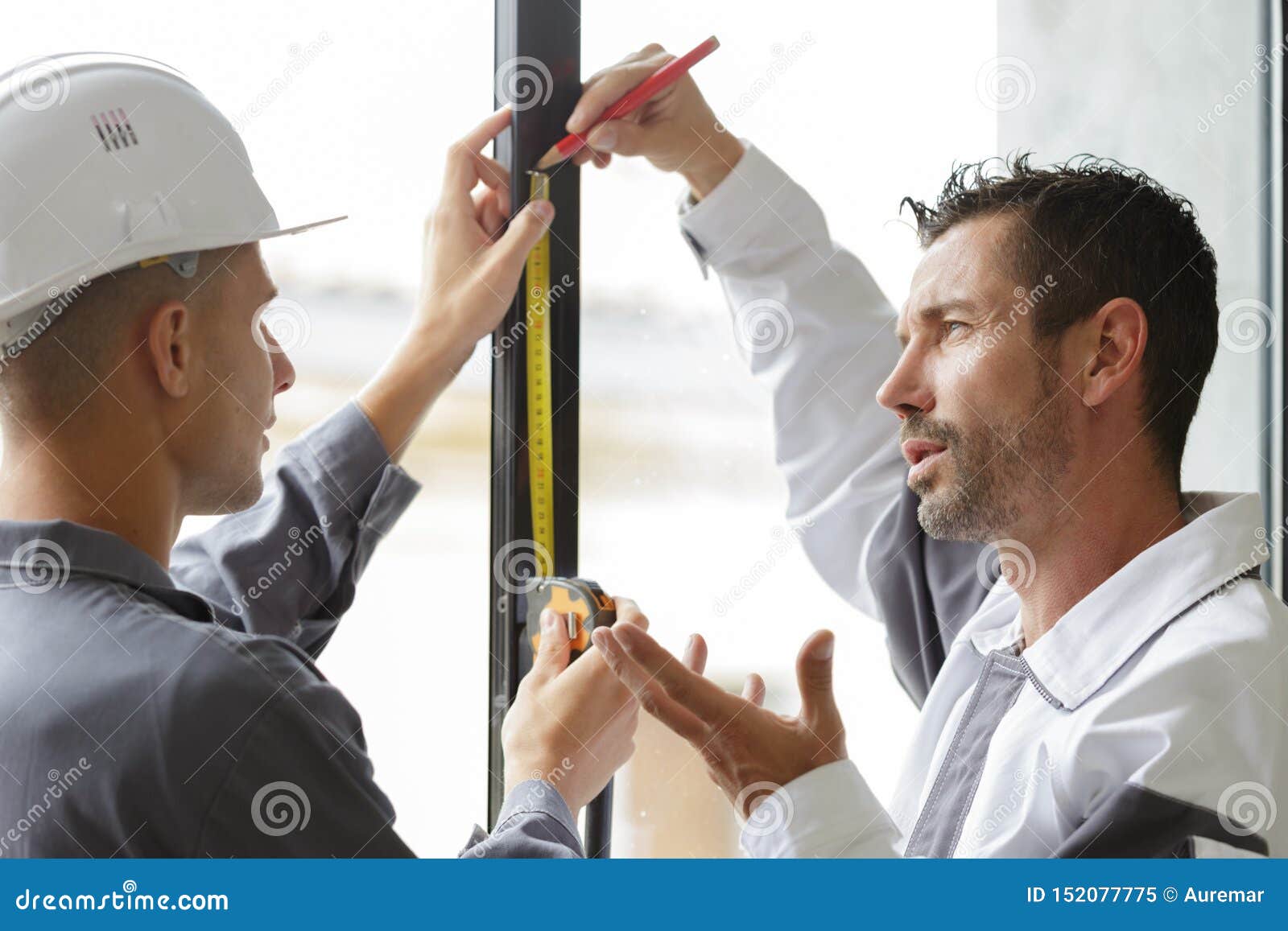 Man and Apprentice Measuring Window Stock Image - Image of outdoors ...
