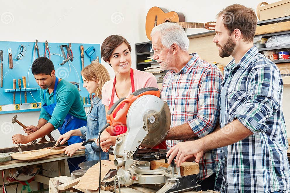 Man with Apprentice and Trainee in Workshop Stock Photo - Image of ...