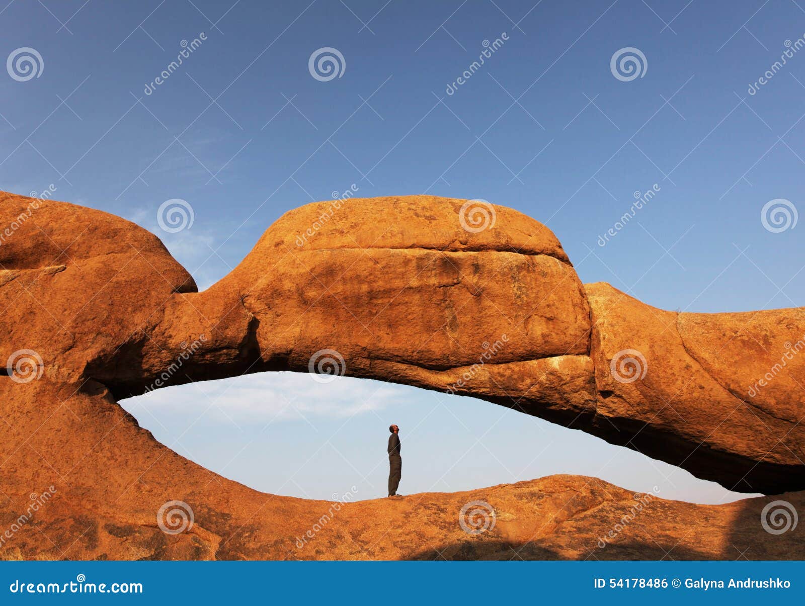 Man in arch stock photo. Image of nature, landscape, cliff - 54178486