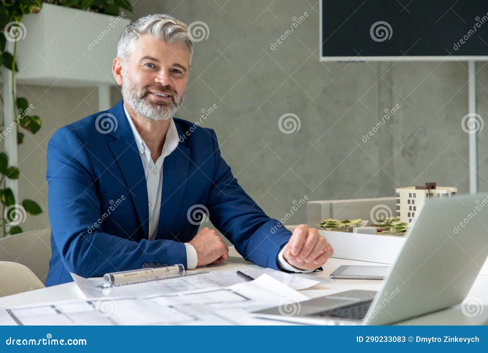 Man Architect with Beard Working on Some Project, Sitting at Table in ...