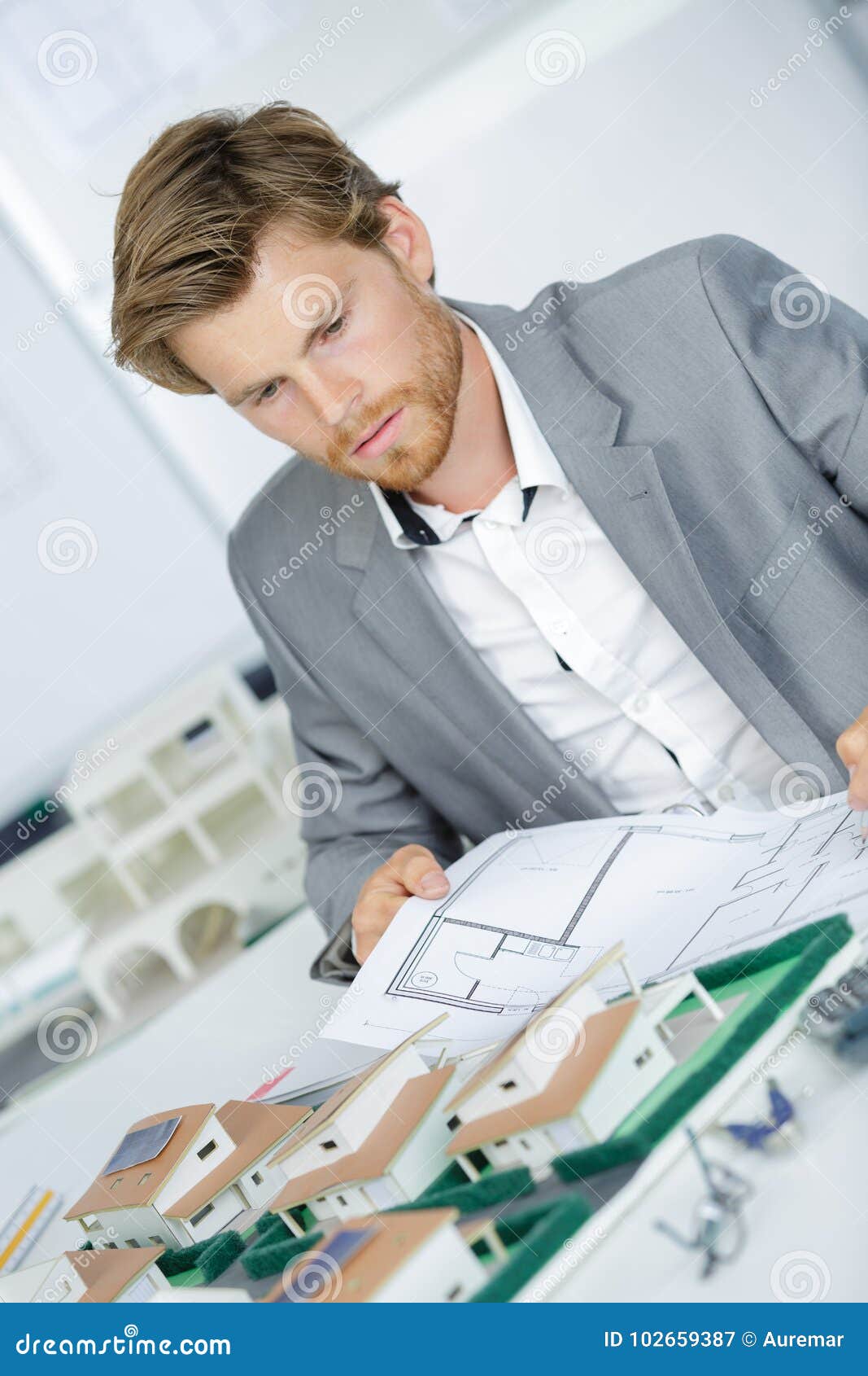 Man architect checks plan stock image. Image of construction - 102659387