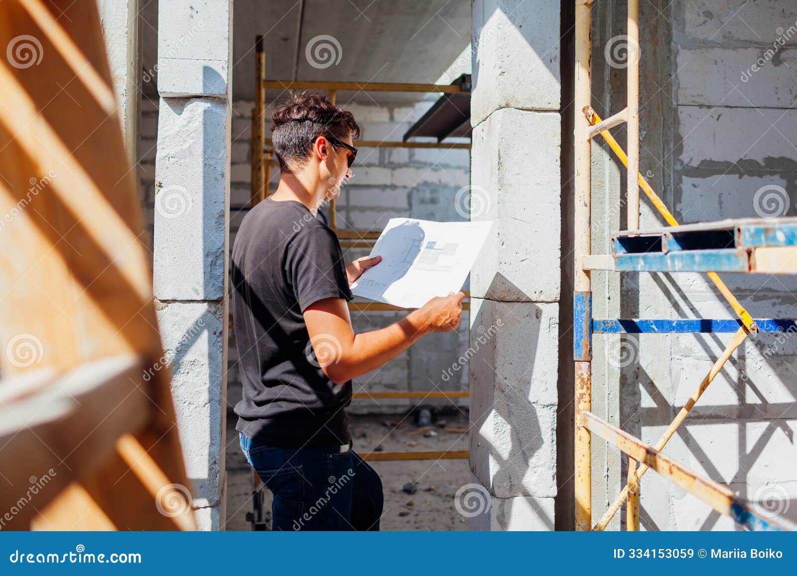 Man Architect Engineer Checking House Under Construction Comparing with ...