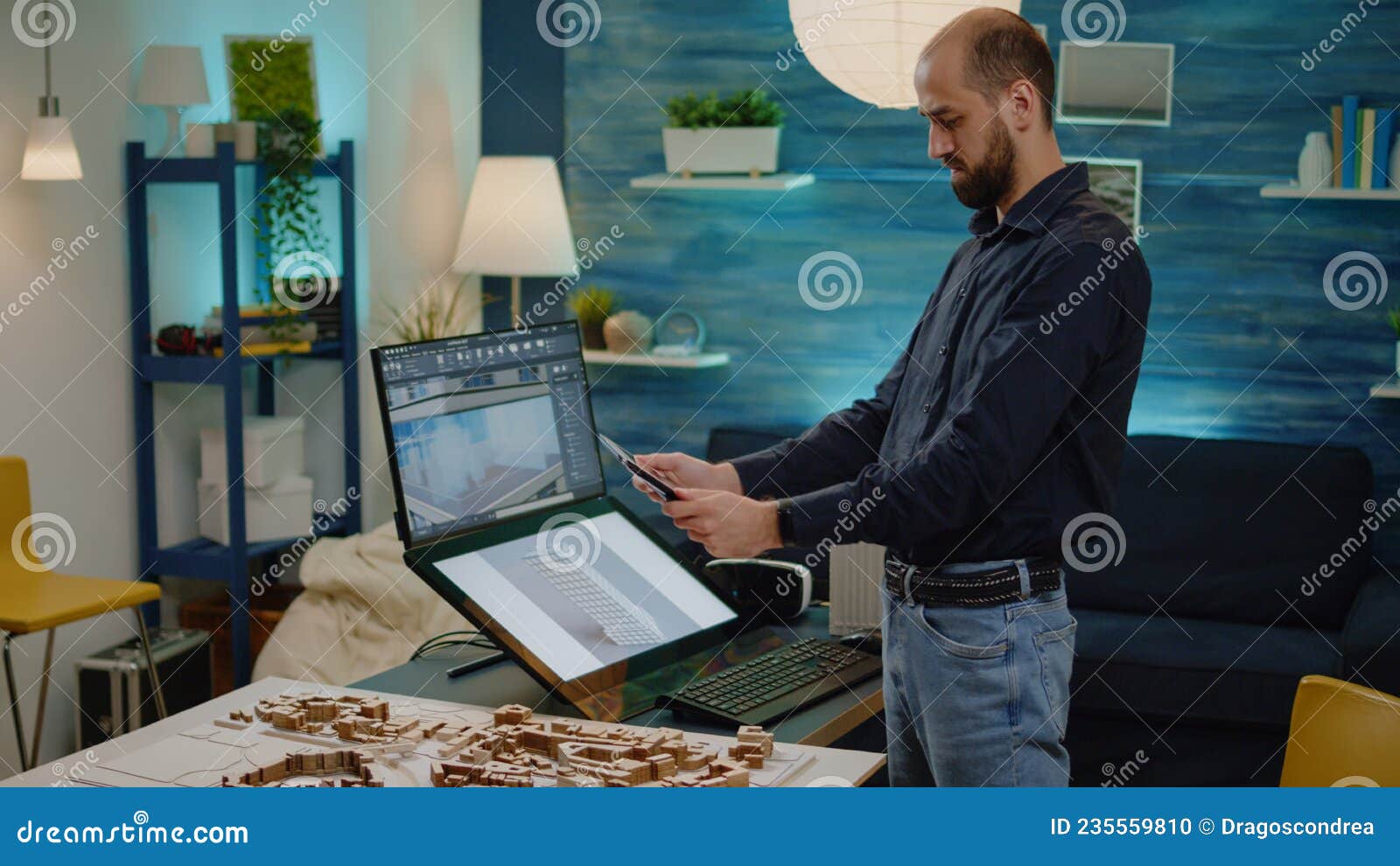 Man Architect Looking at Tablet with Building Design Plan Stock Photo ...