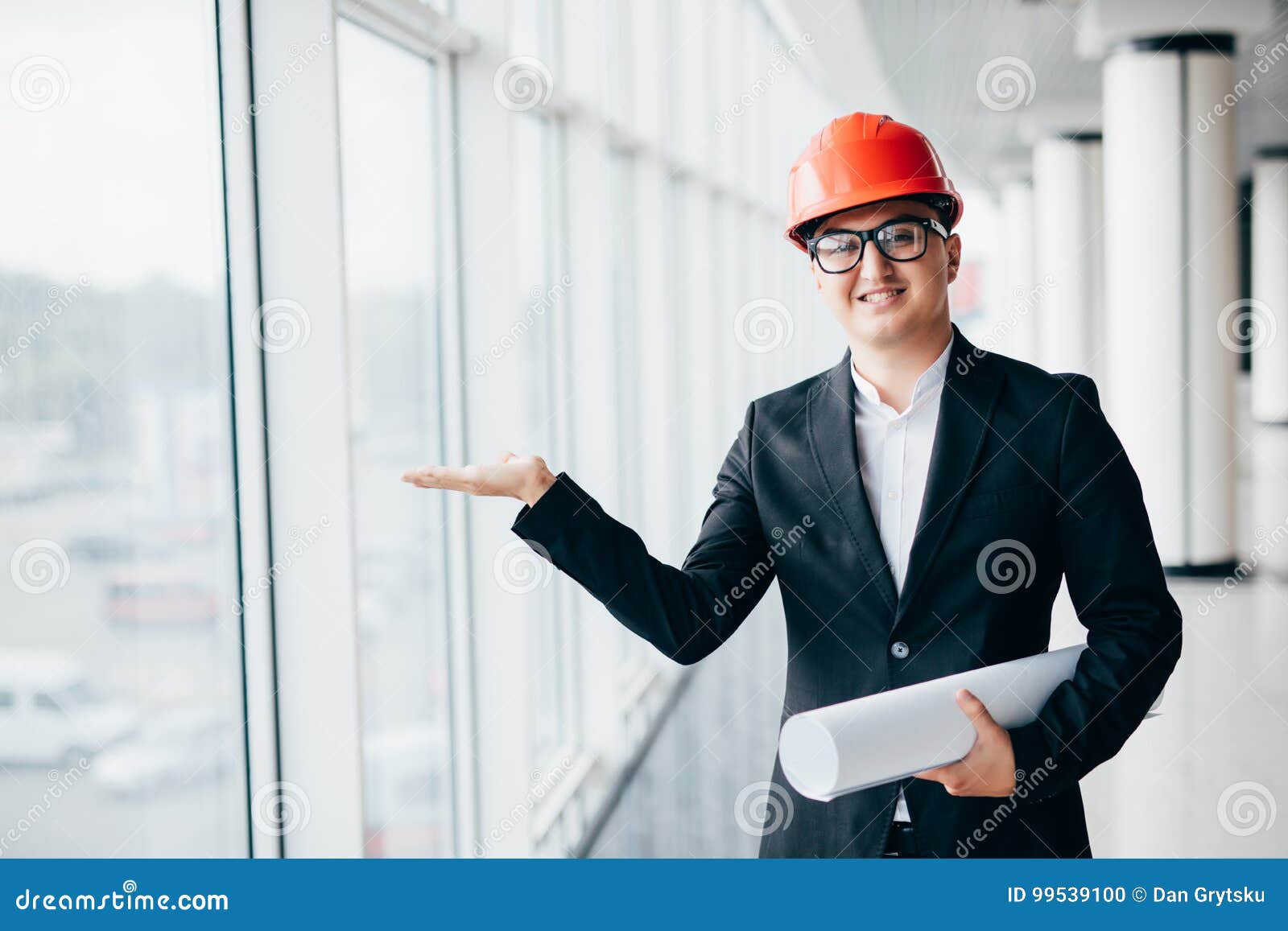 Man Architect in Protective Hamlet Looking at Blueprints in Hamlet with ...
