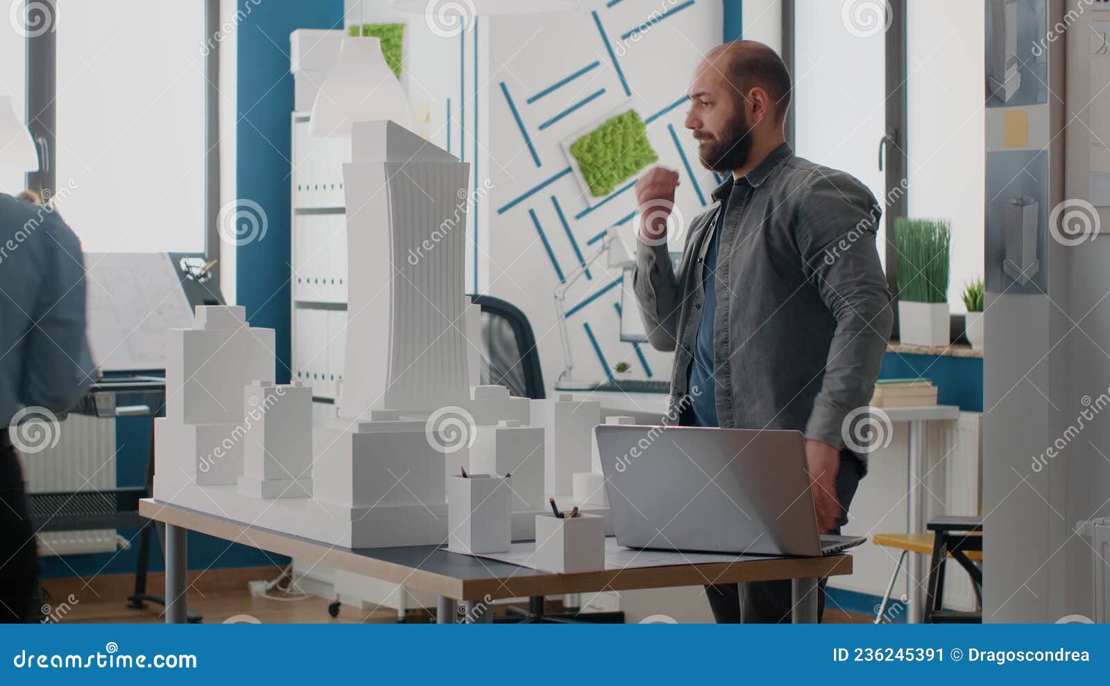 Man Architect Working with Laptop and Building Model To Design ...