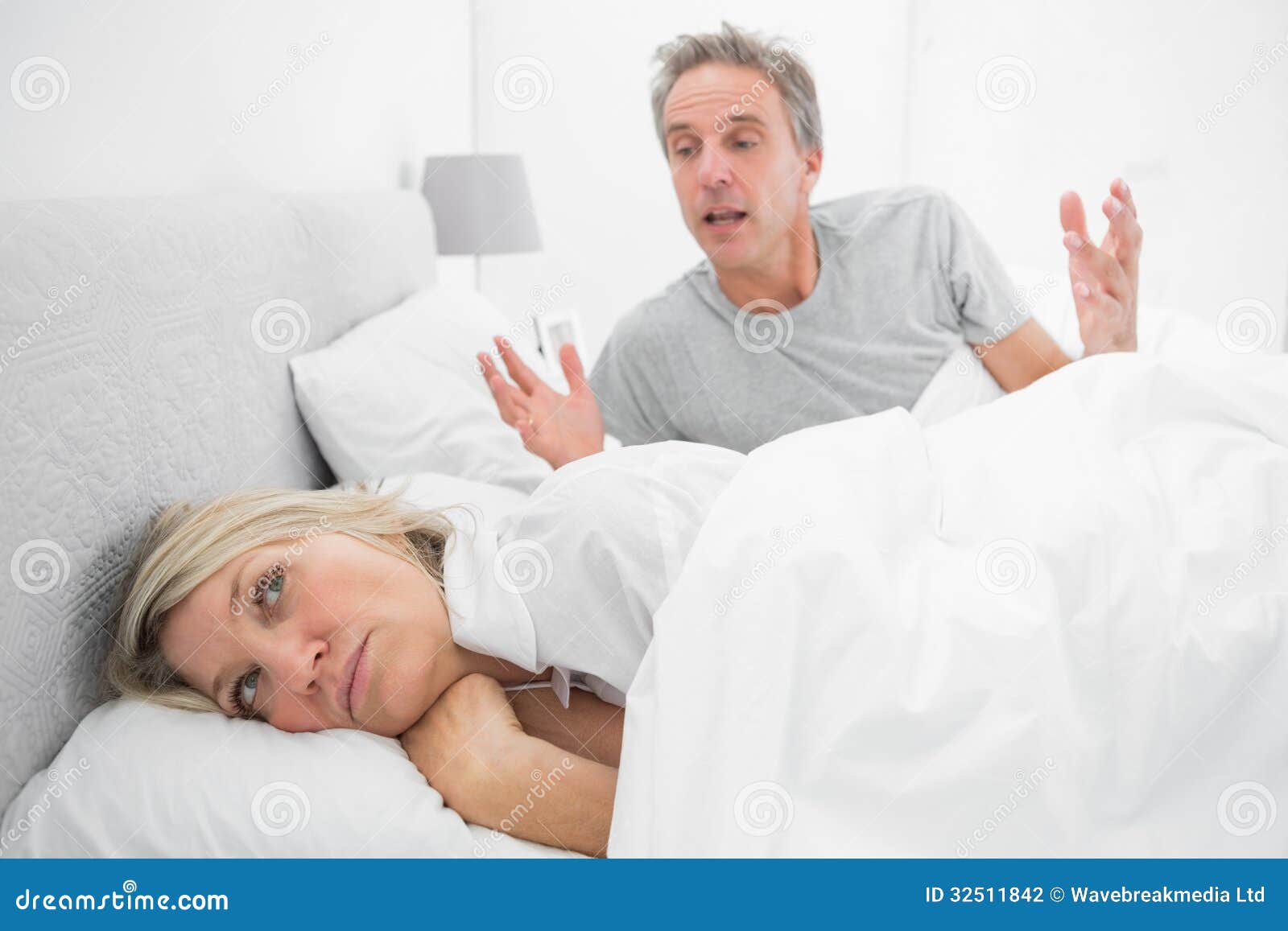 Man Arguing with His Partner in Bed Stock Photo - Image of household ...