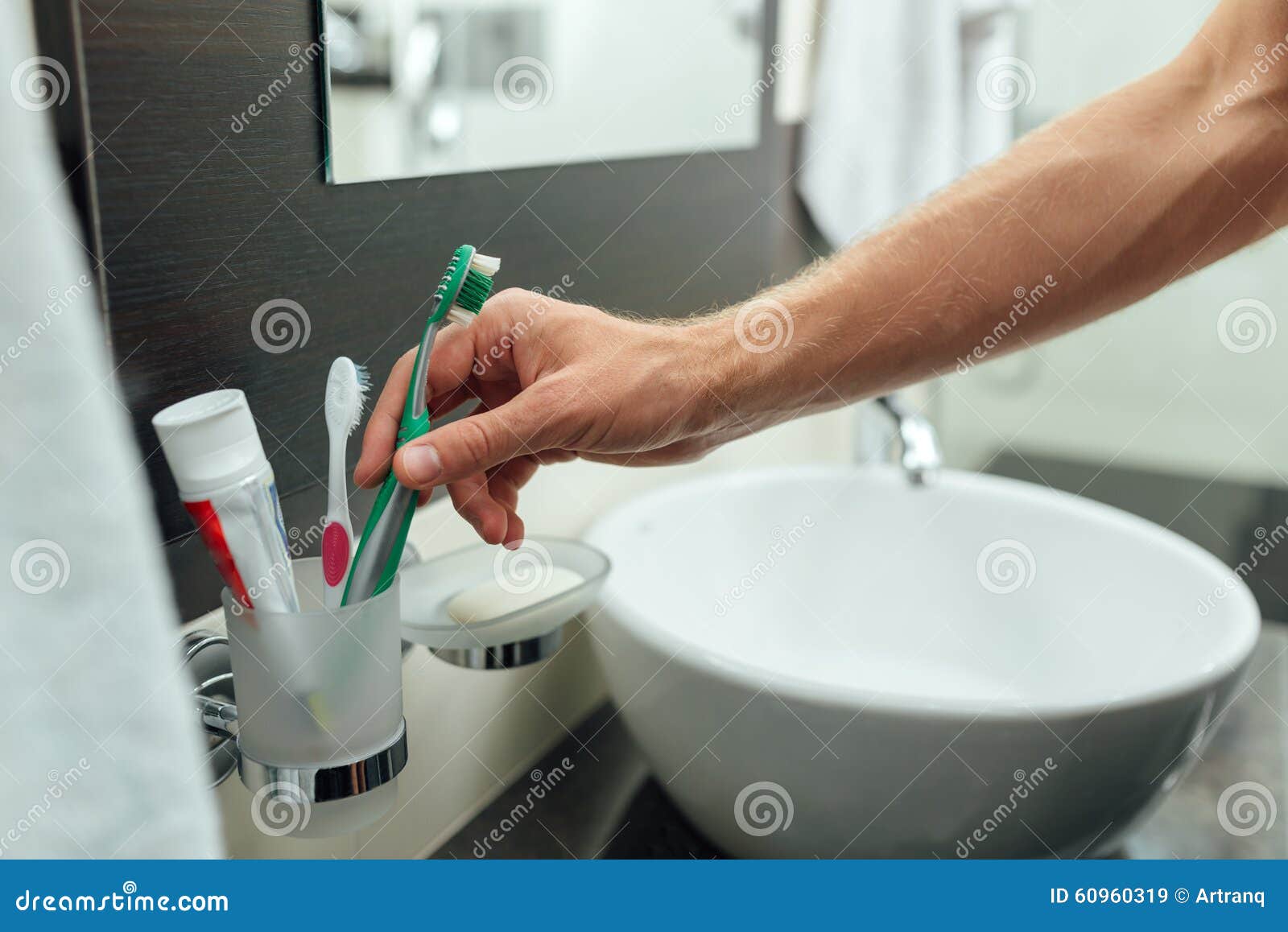 Man arm takes a toothbrush stock image. Image of indoor - 60960319